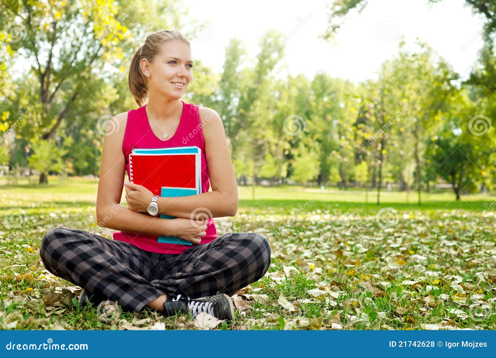 Student in Park Hugging Books Stock Photo - Image of grass, green: 21742628