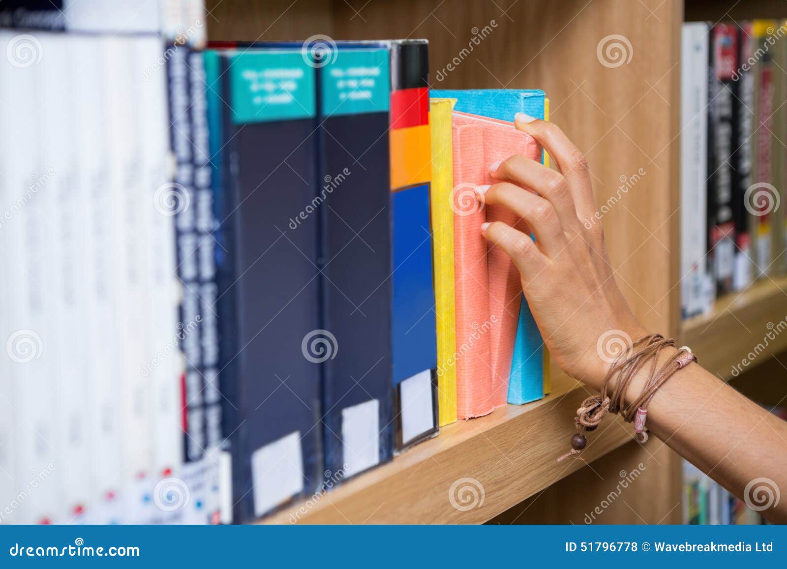 Student Picking a Book from Shelf in Library Stock Photo - Image of ...