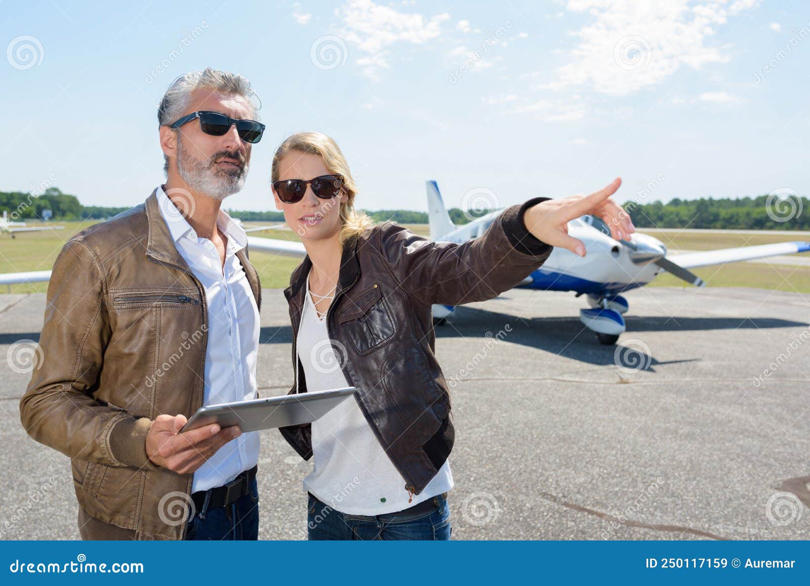 Student And Pilot Discussing Flight Route Over An Aviation Chart Stock ...