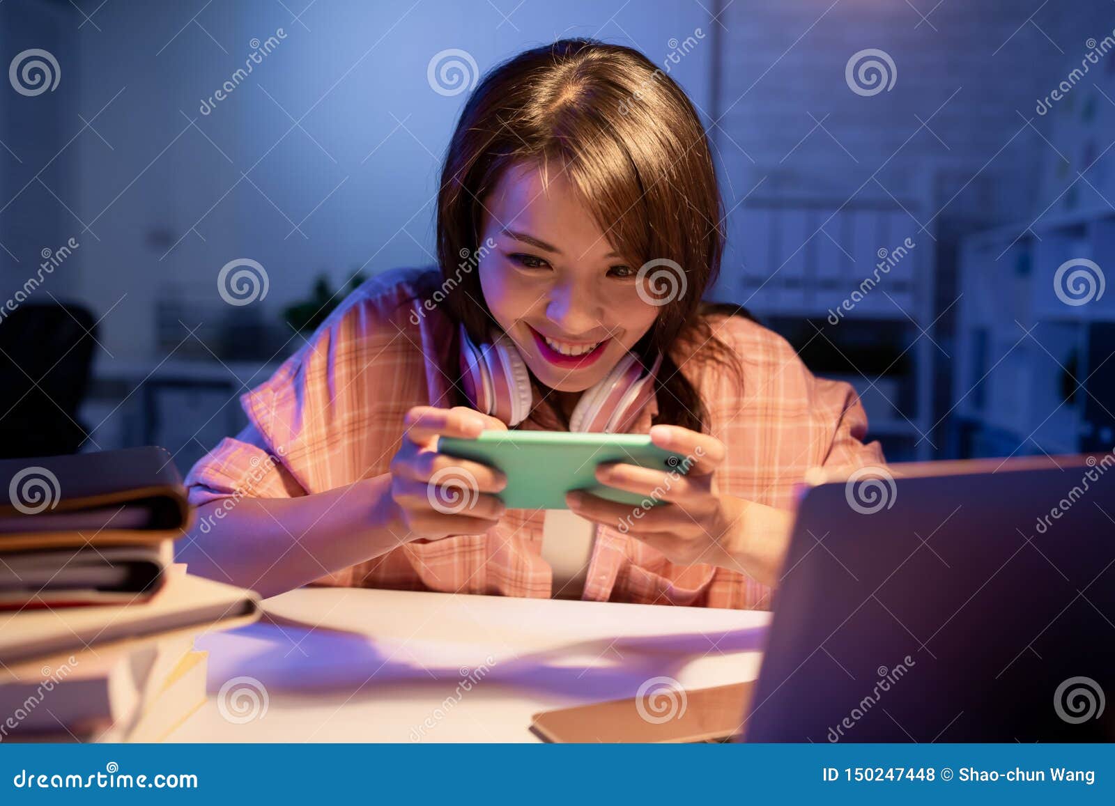 Student play game on phone stock photo. Image of media - 150247448