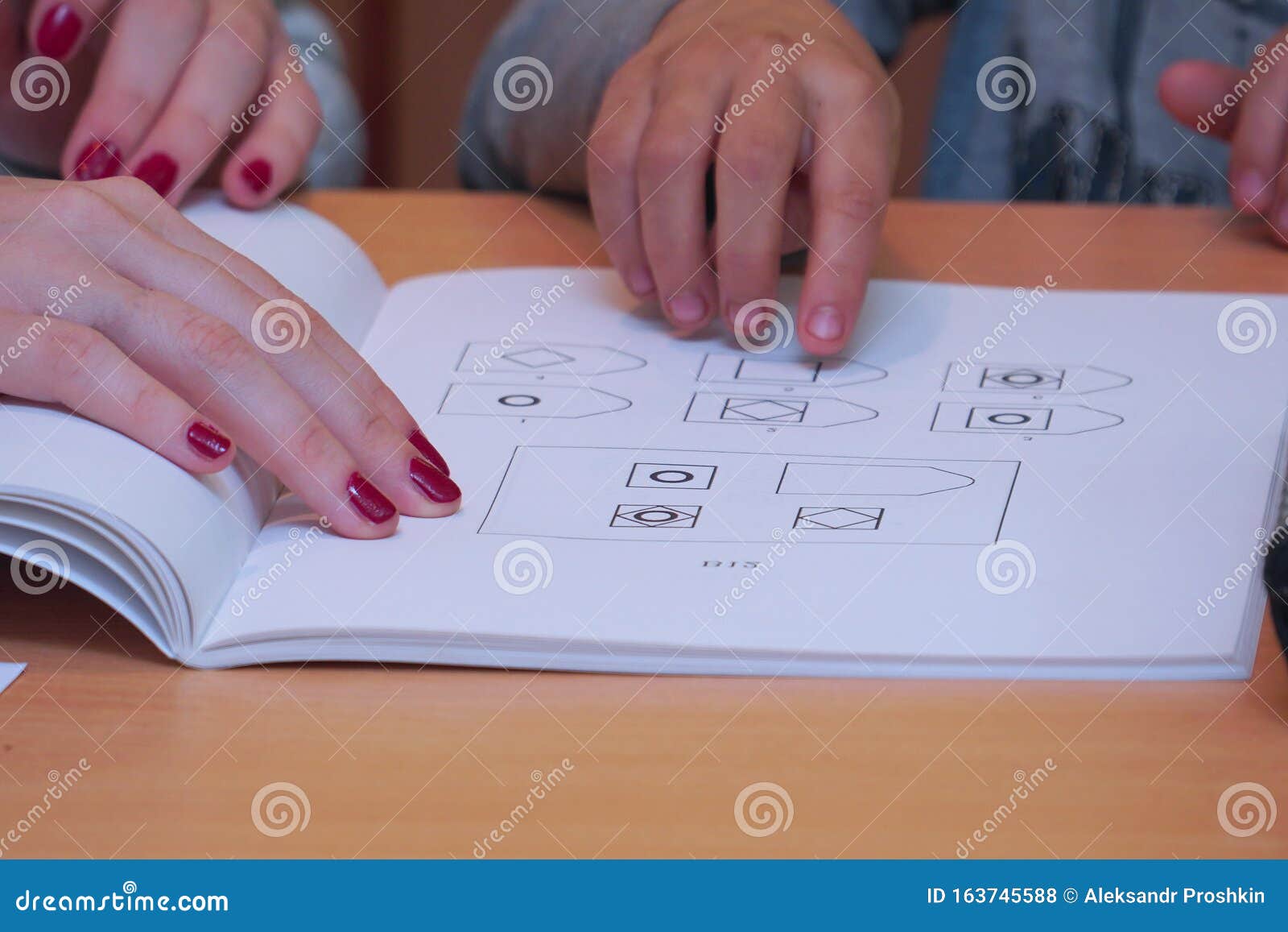 The Student Points a Finger at the Teacher at the Figures in the ...