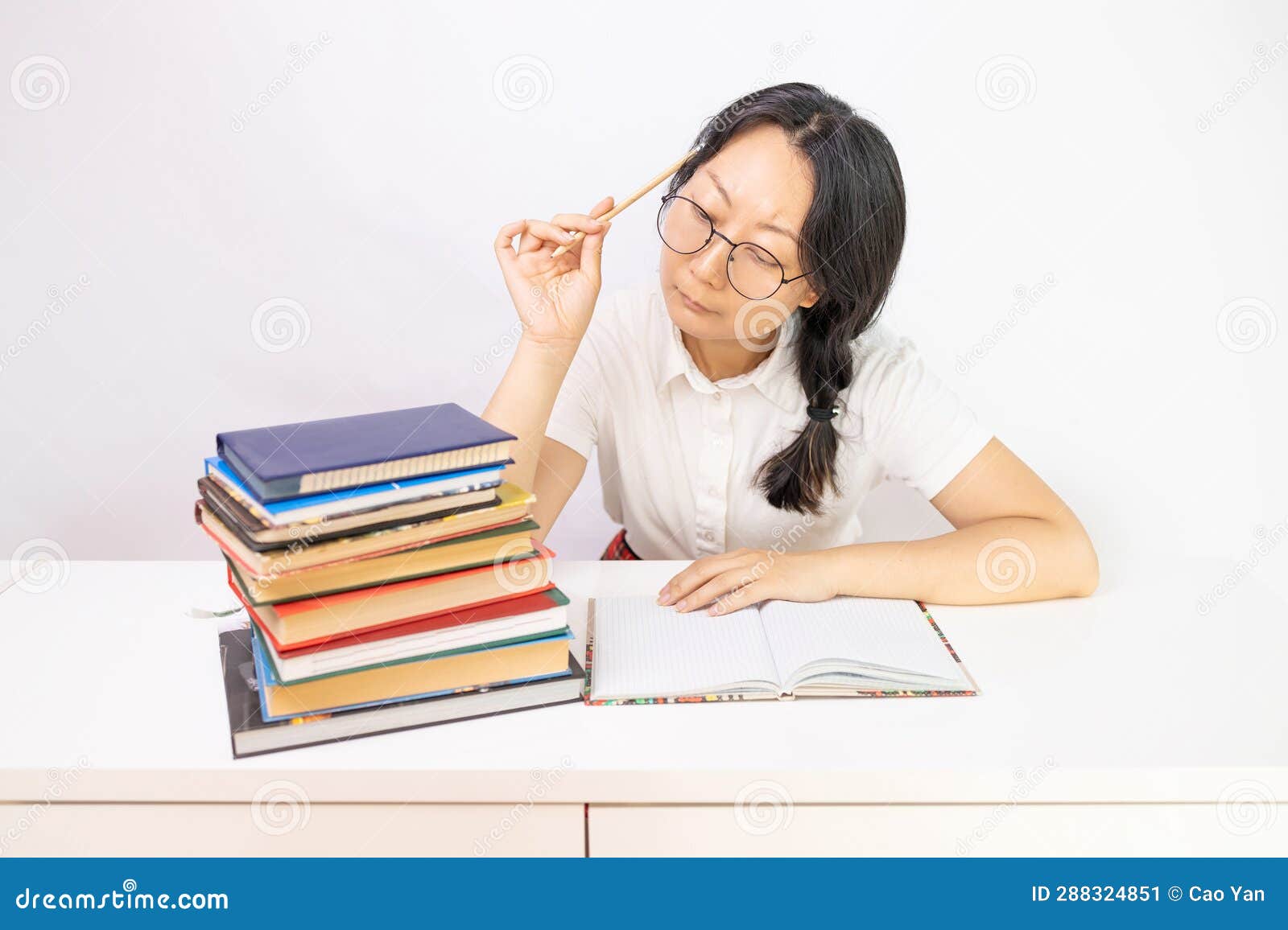 Student Preparing for College Test, Exam, Reading Book, Studying ...