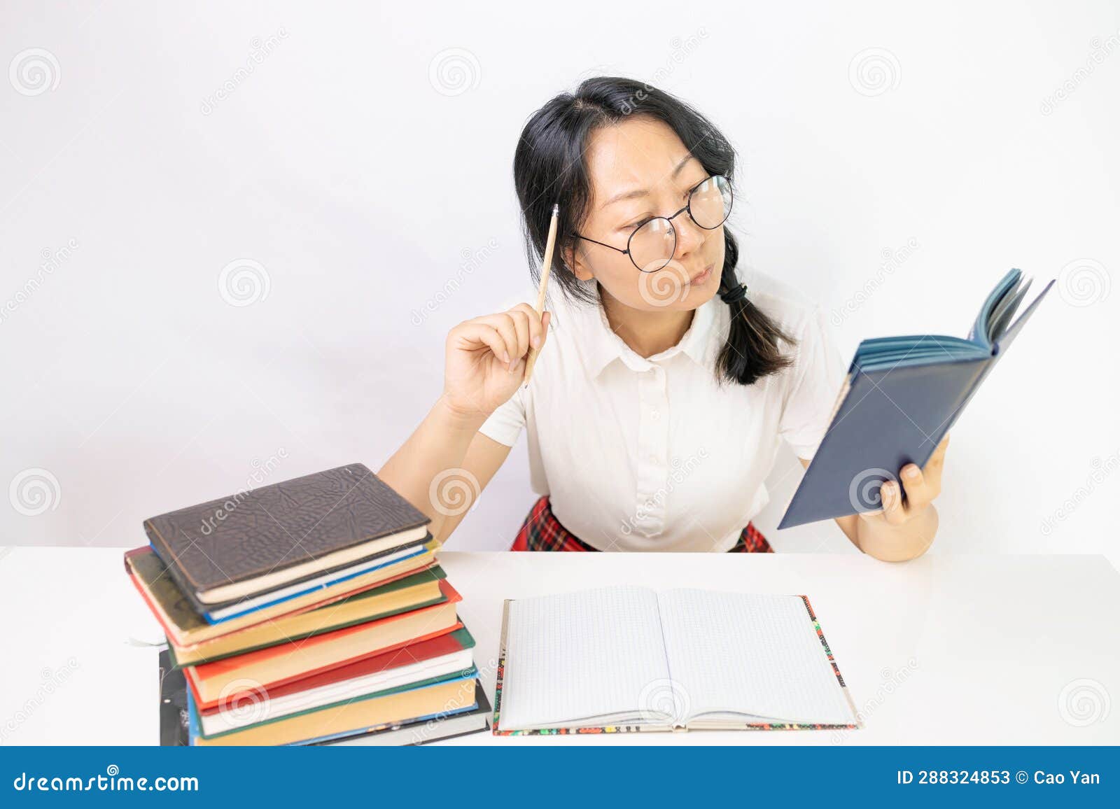 Student Preparing for College Test, Exam, Reading Book, Studying ...