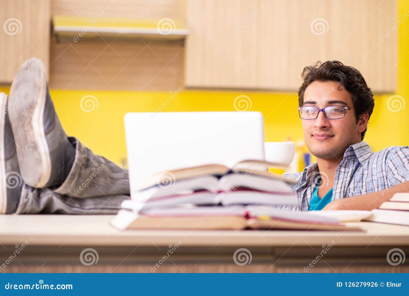 The Student Preparing for Exam Sitting at the Kitchen Stock Photo ...