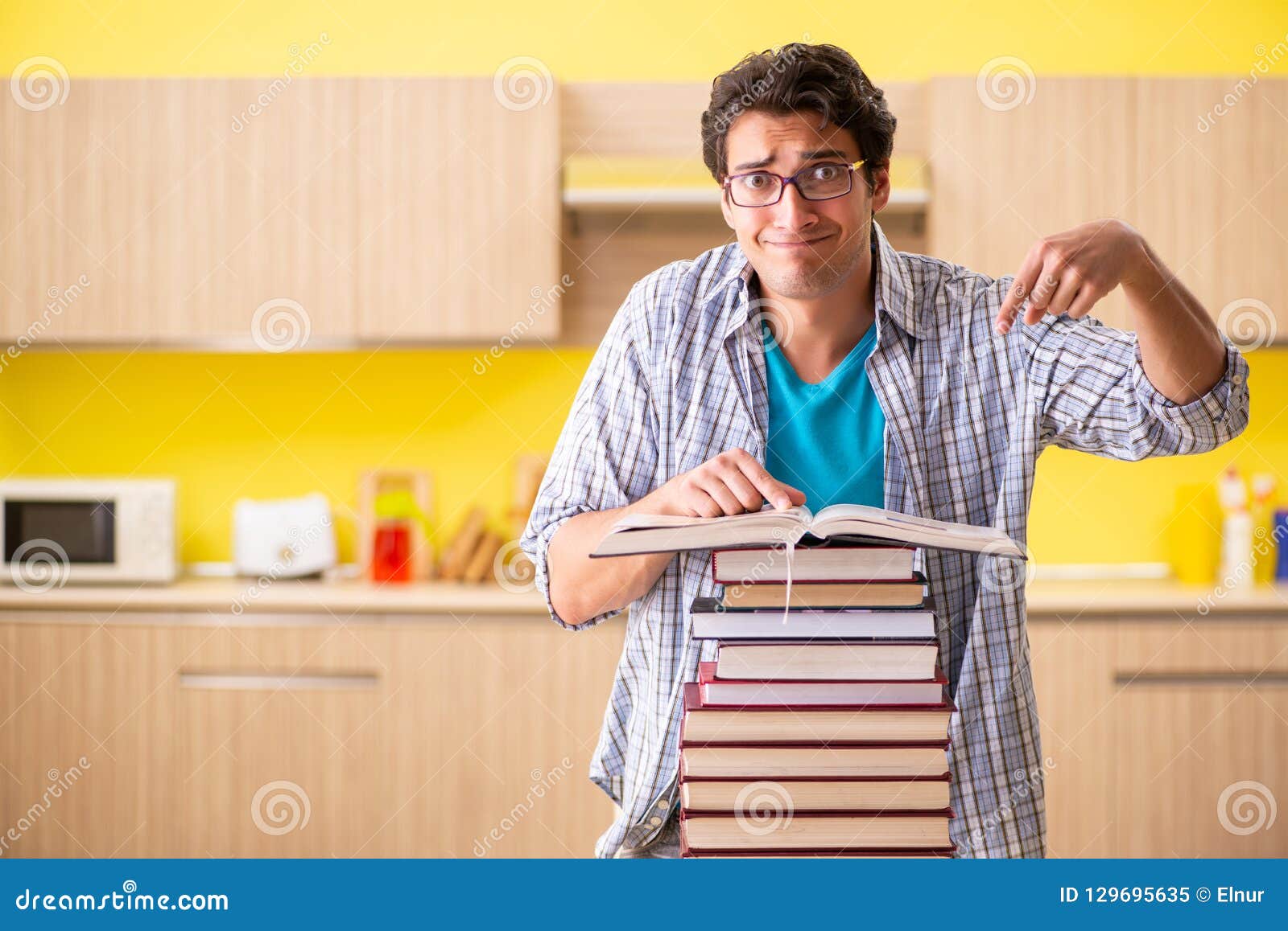 The Student Preparing for Exam Sitting at the Kitchen Stock Image ...