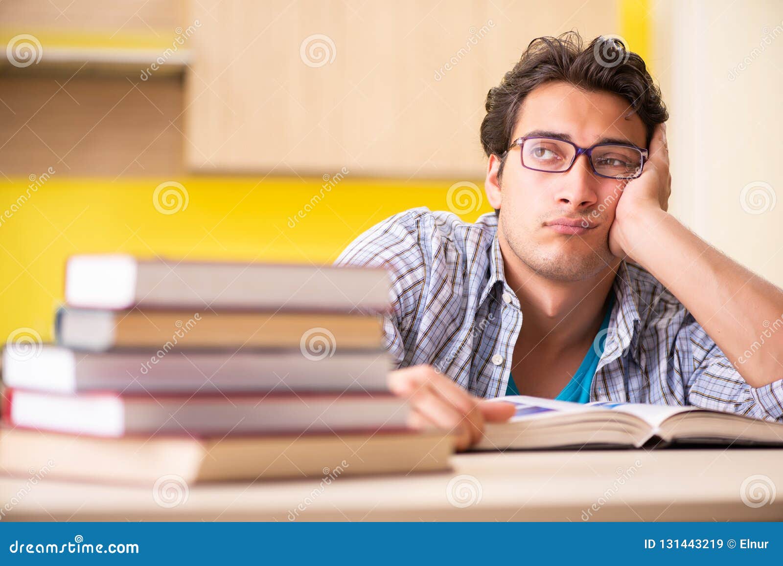 The Student Preparing for Exam Sitting at the Kitchen Stock Image ...