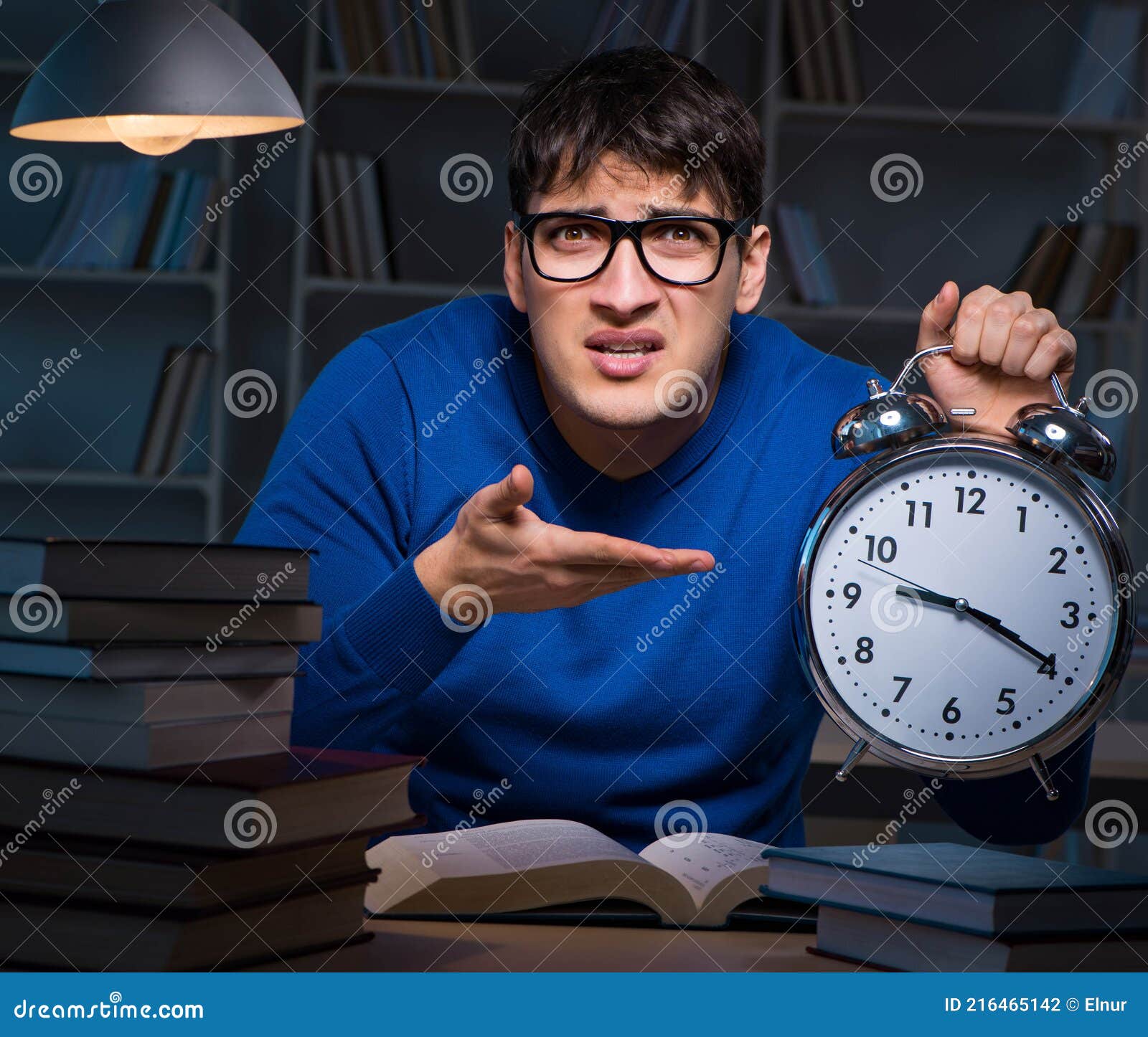 Student Preparing for Exams Late at Night in Library Stock Photo ...