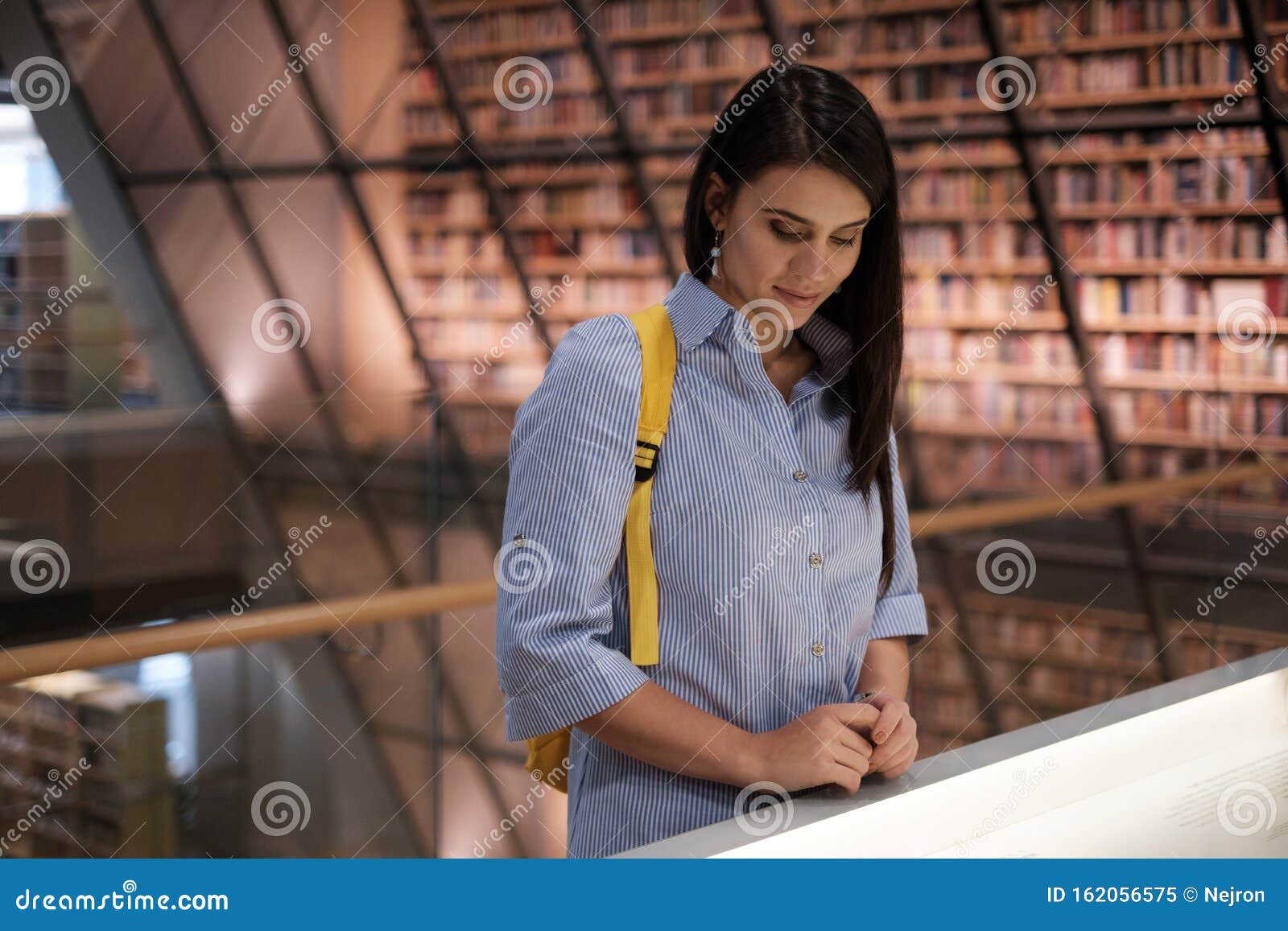 Student in a Public Library Stock Image - Image of looking ...