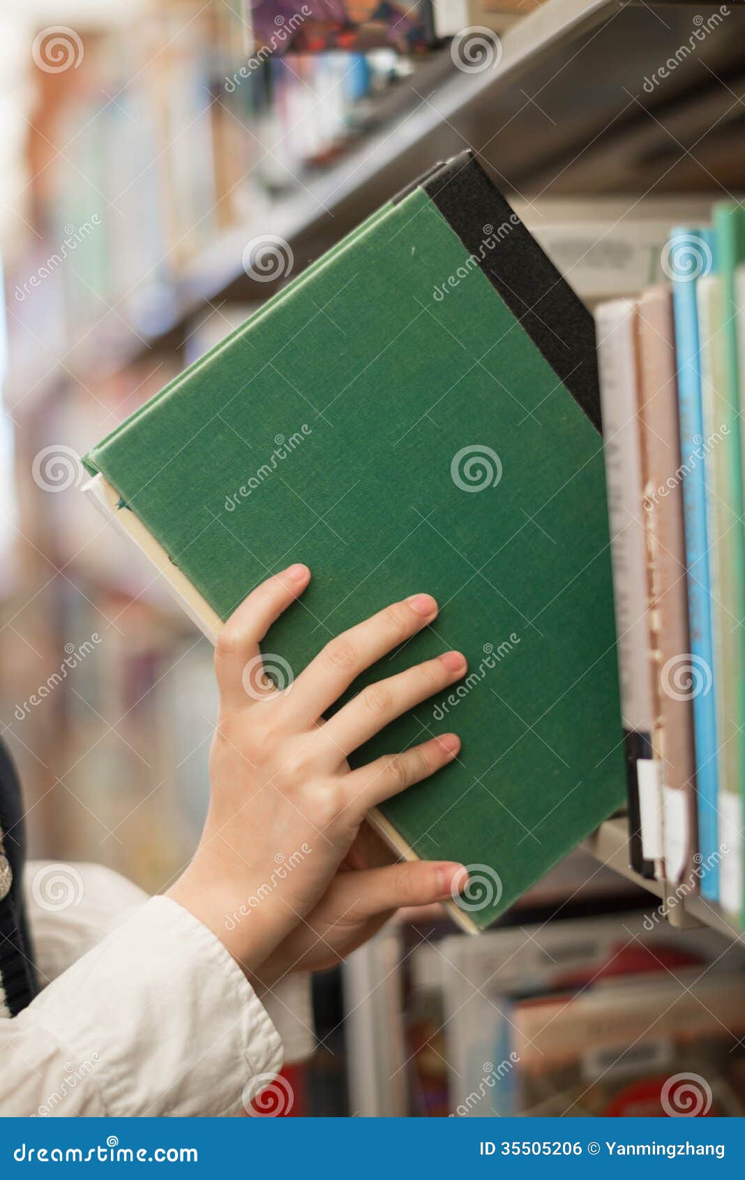 Student Putting Book Back Onto a Bookshelf Stock Photo - Image of ...