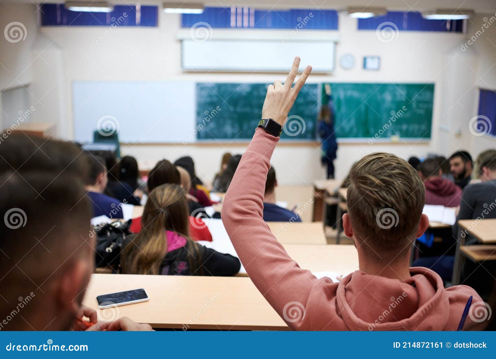 The Student Raises His Hands Asking a Question in Class in College ...