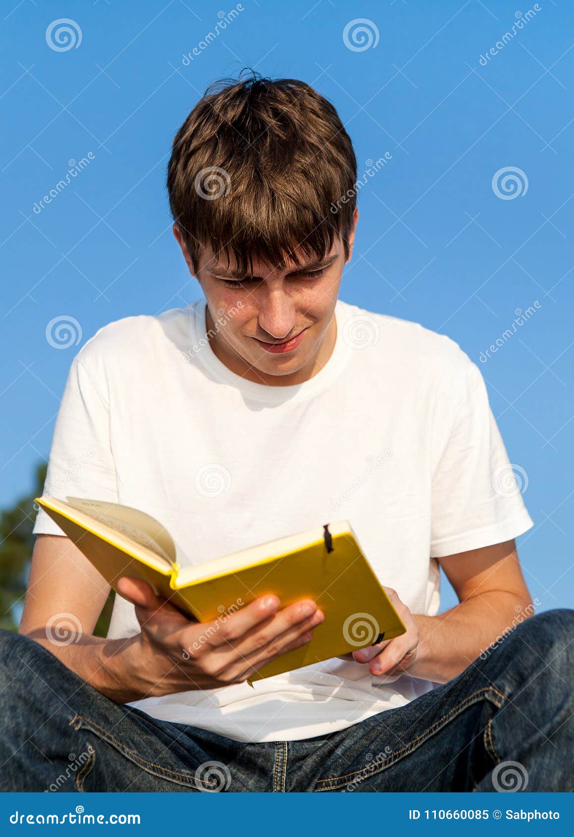 Student with a book stock image. Image of pensive, smile - 110660085