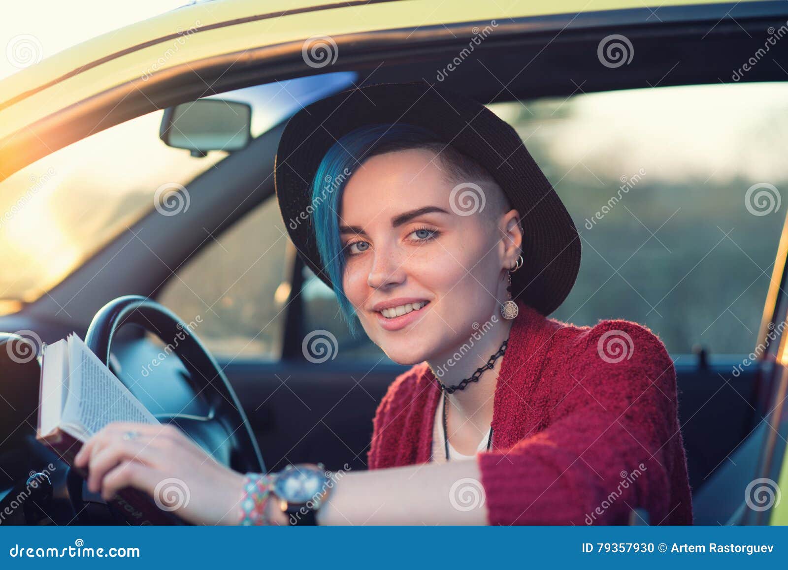 Student Reading Book in Car Stock Photo - Image of cute, auto: 79357930