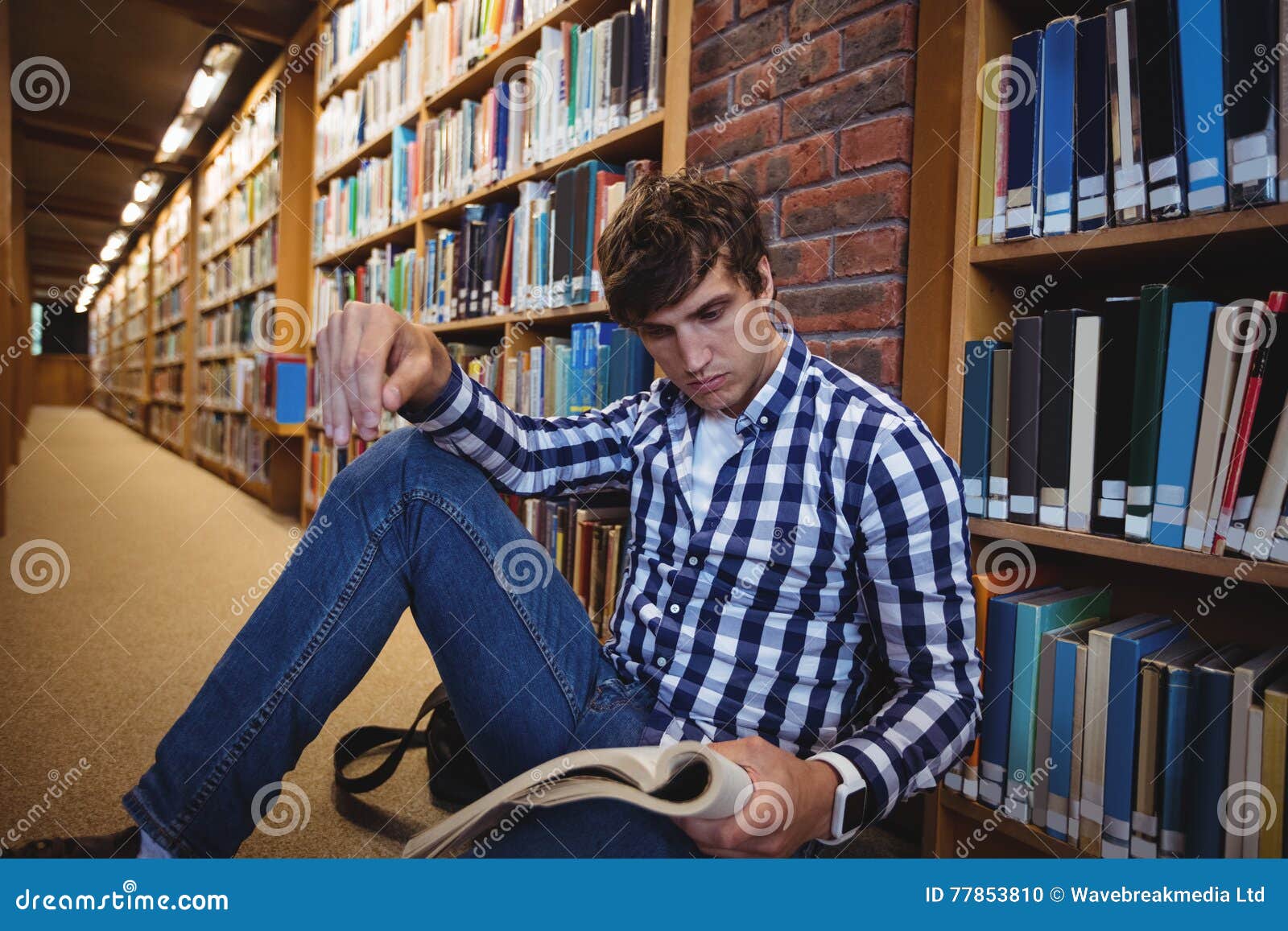 Student Reading Book in College Library Stock Photo - Image of research ...