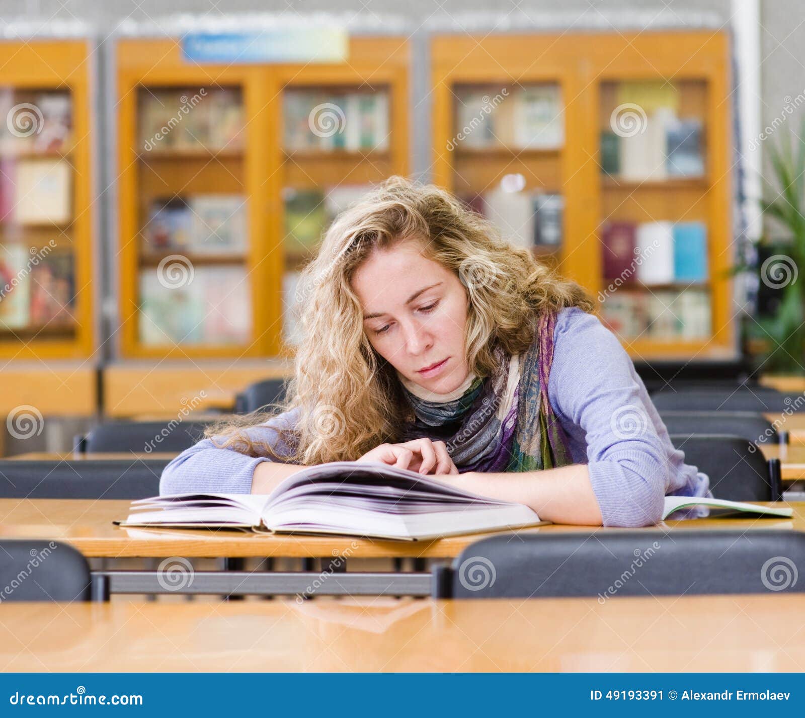 Student Reading a Book in the Library Stock Image - Image of classroom ...