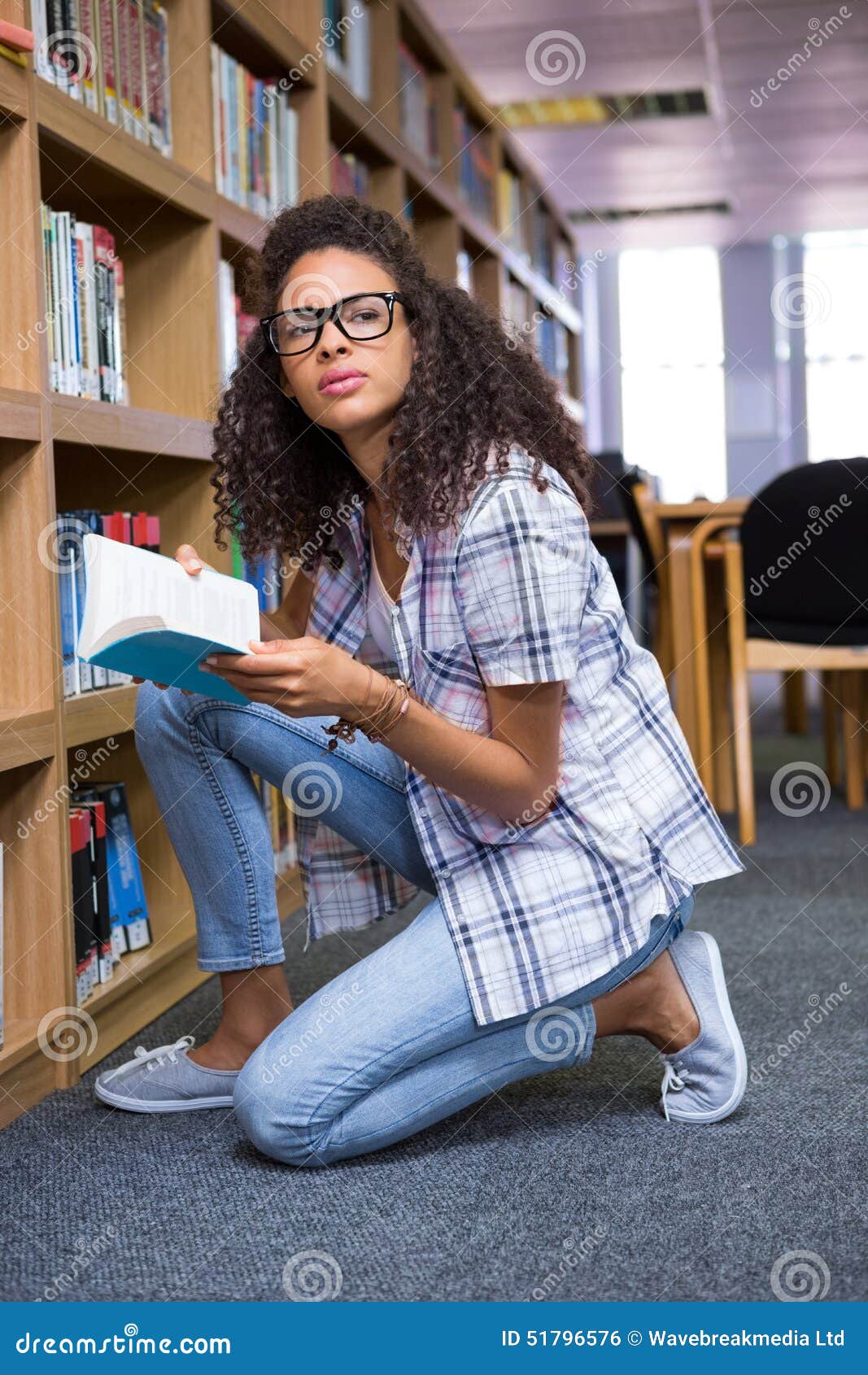 Student Reading Book in Library Stock Photo - Image of bookshelf ...