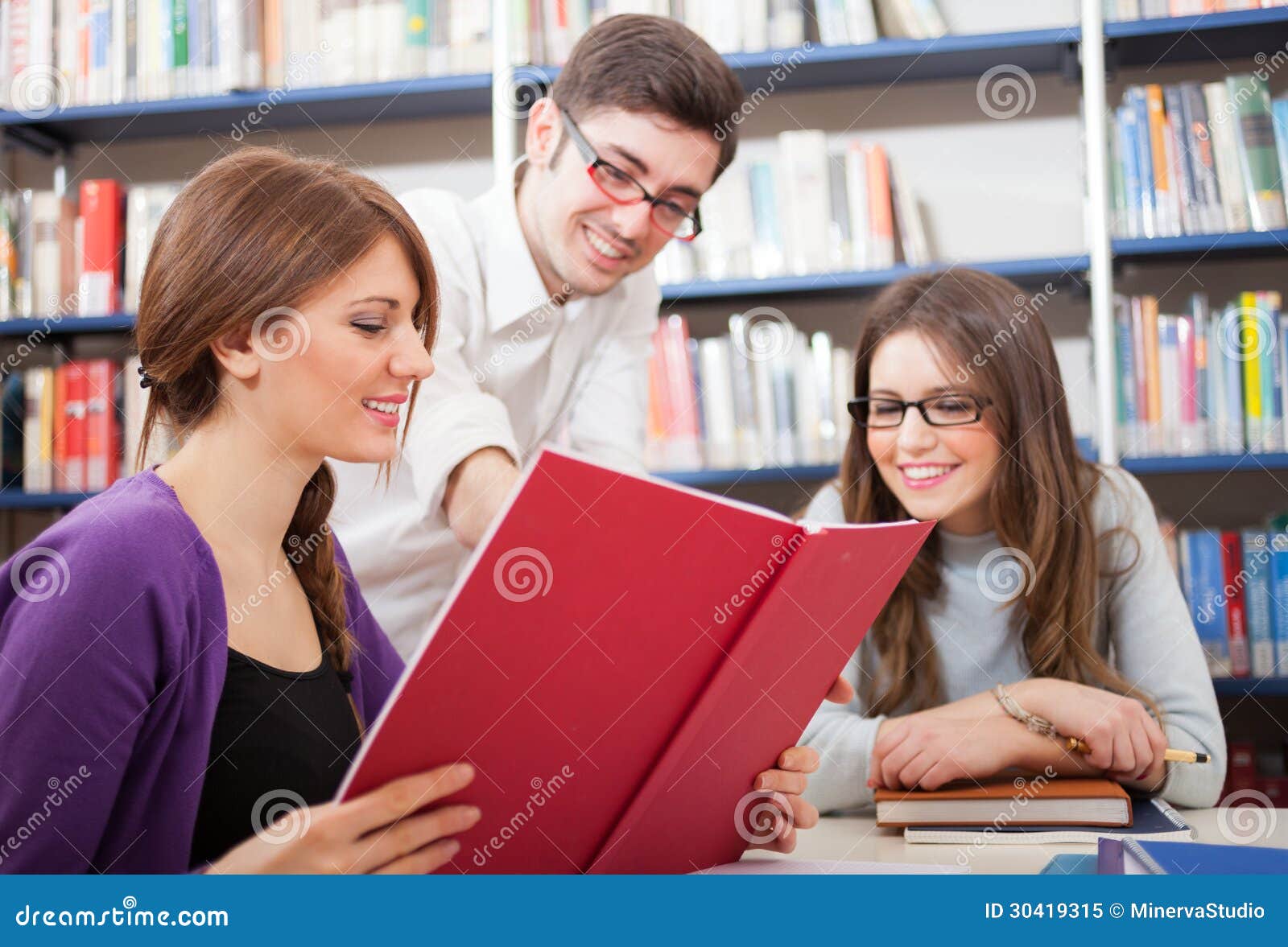 Student reading a book stock image. Image of library - 30419315
