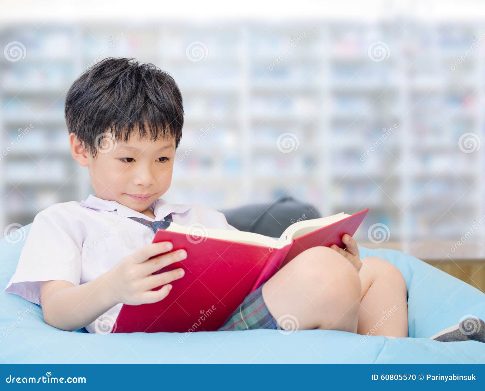 Student Reading Book in School Library Stock Photo - Image of classroom ...