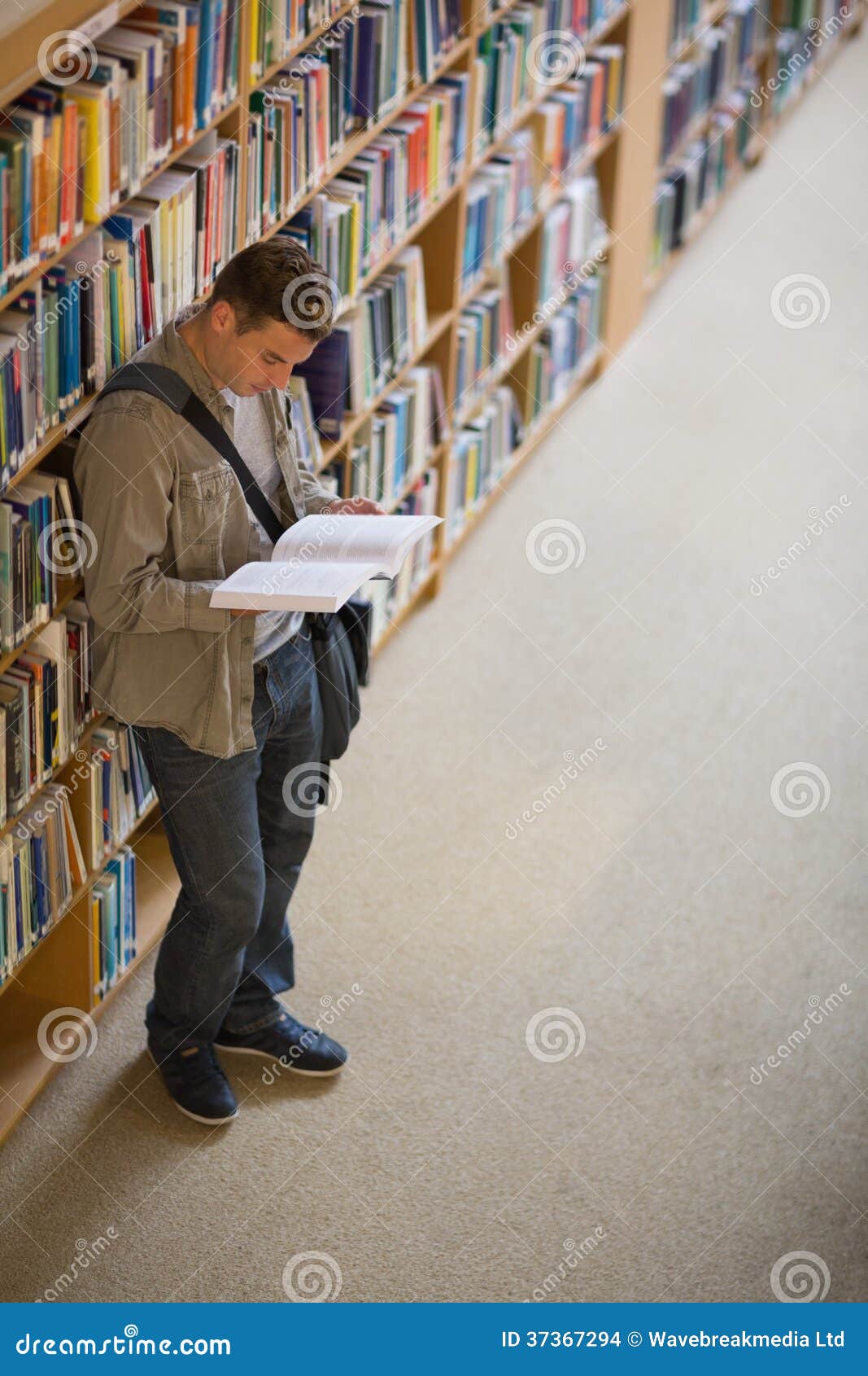 Student Reading a Book Standing in Library Stock Photo - Image of ...