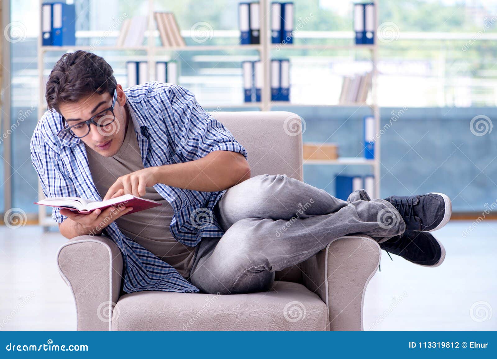 The Student Reading Books and Preparing for Exams in Library Stock ...