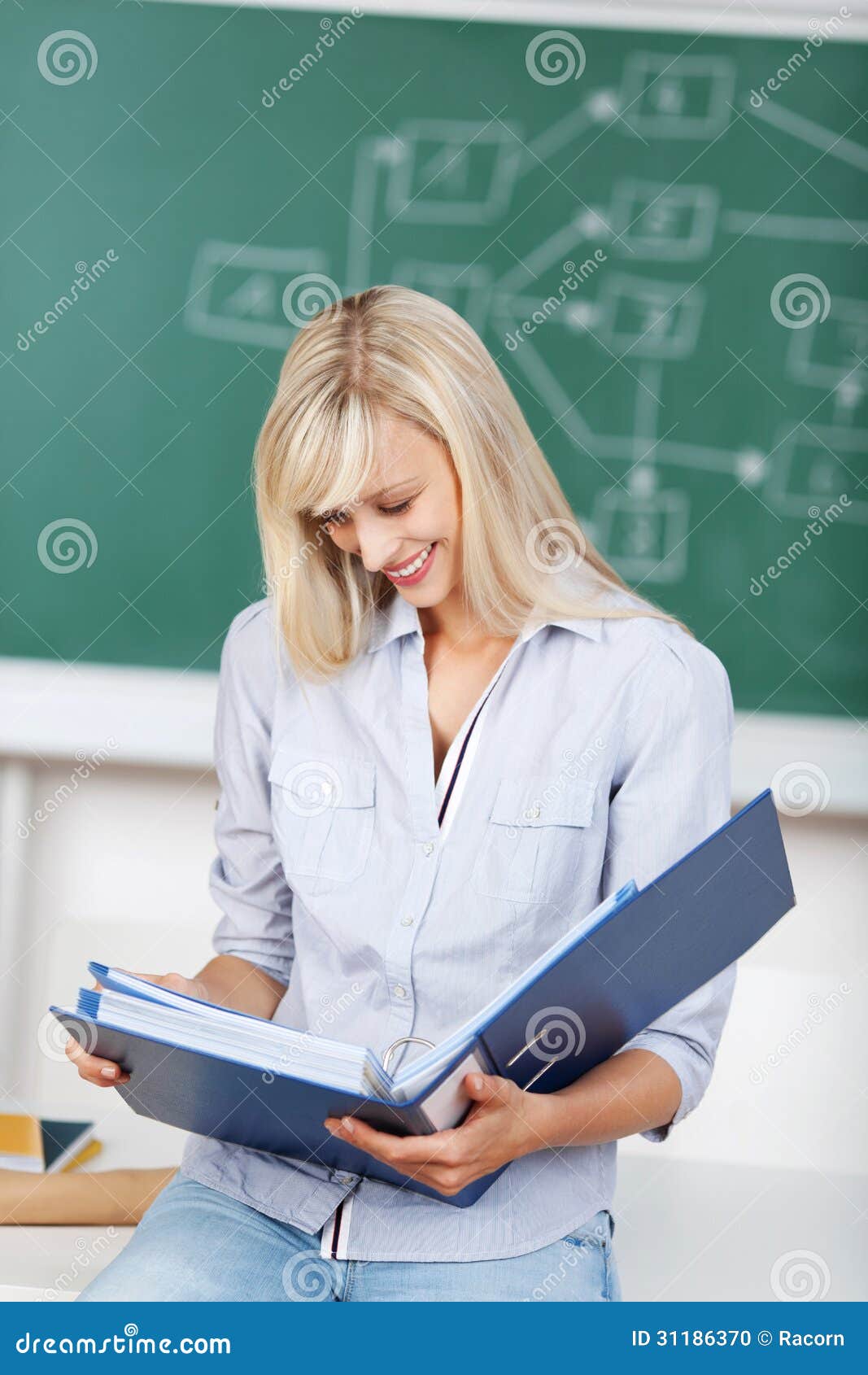 Student Reading at the Classroom Stock Photo - Image of folder ...