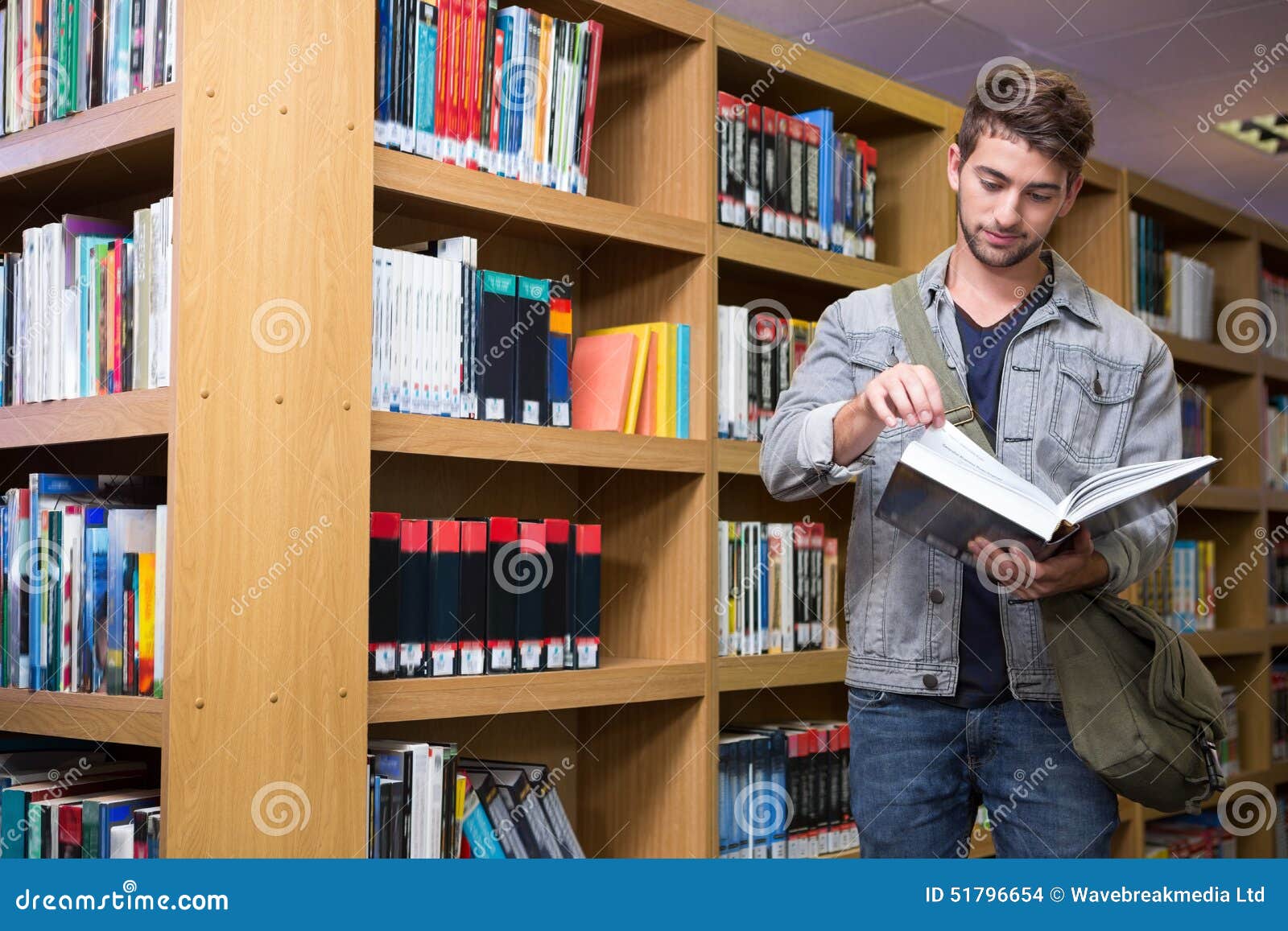 Student reading in library stock photo. Image of concentrated - 51796654
