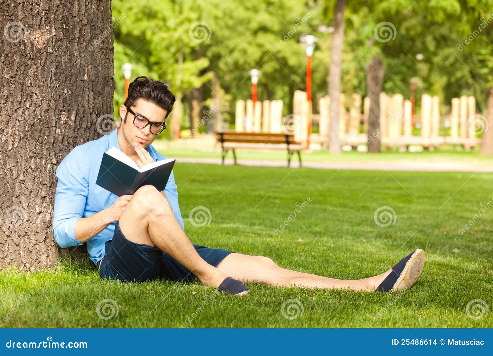 Student Reading and Relaxing in the Park Stock Photo - Image of look ...