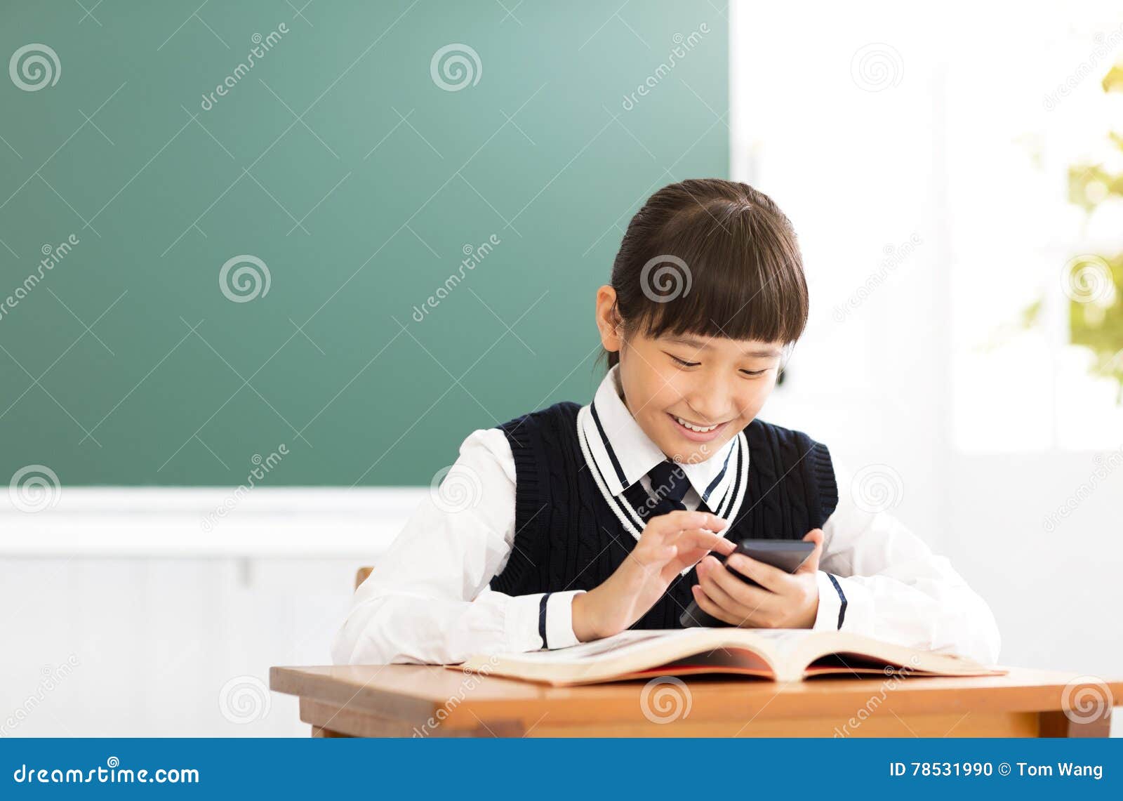 Student Reading Smart Phone in Classroom Stock Photo - Image of ...