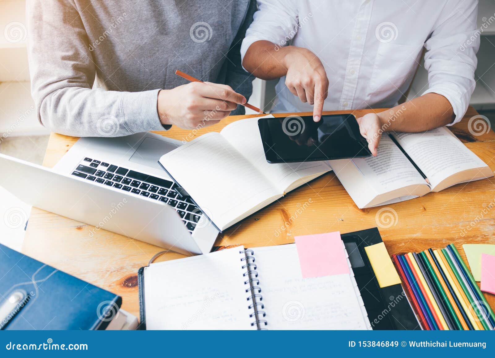 Student Reading Textbook for Test Together in Library Stock Image ...