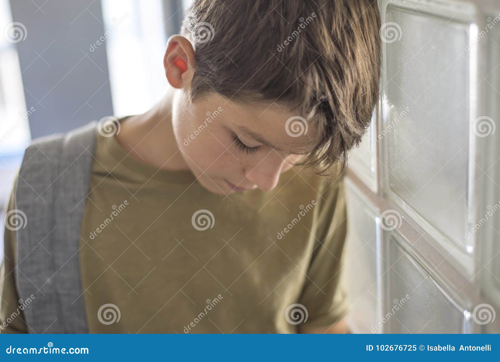 Student Resting on the School and Playing with a Mobile Phone Stock ...