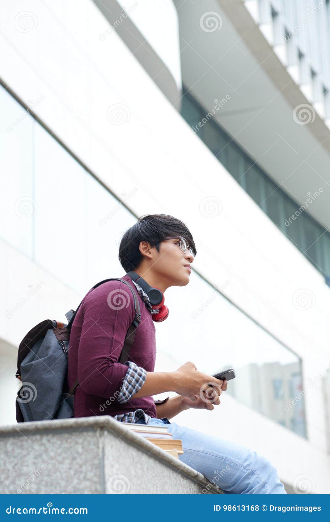 Student resting outdoors stock photo. Image of glasses - 98613168