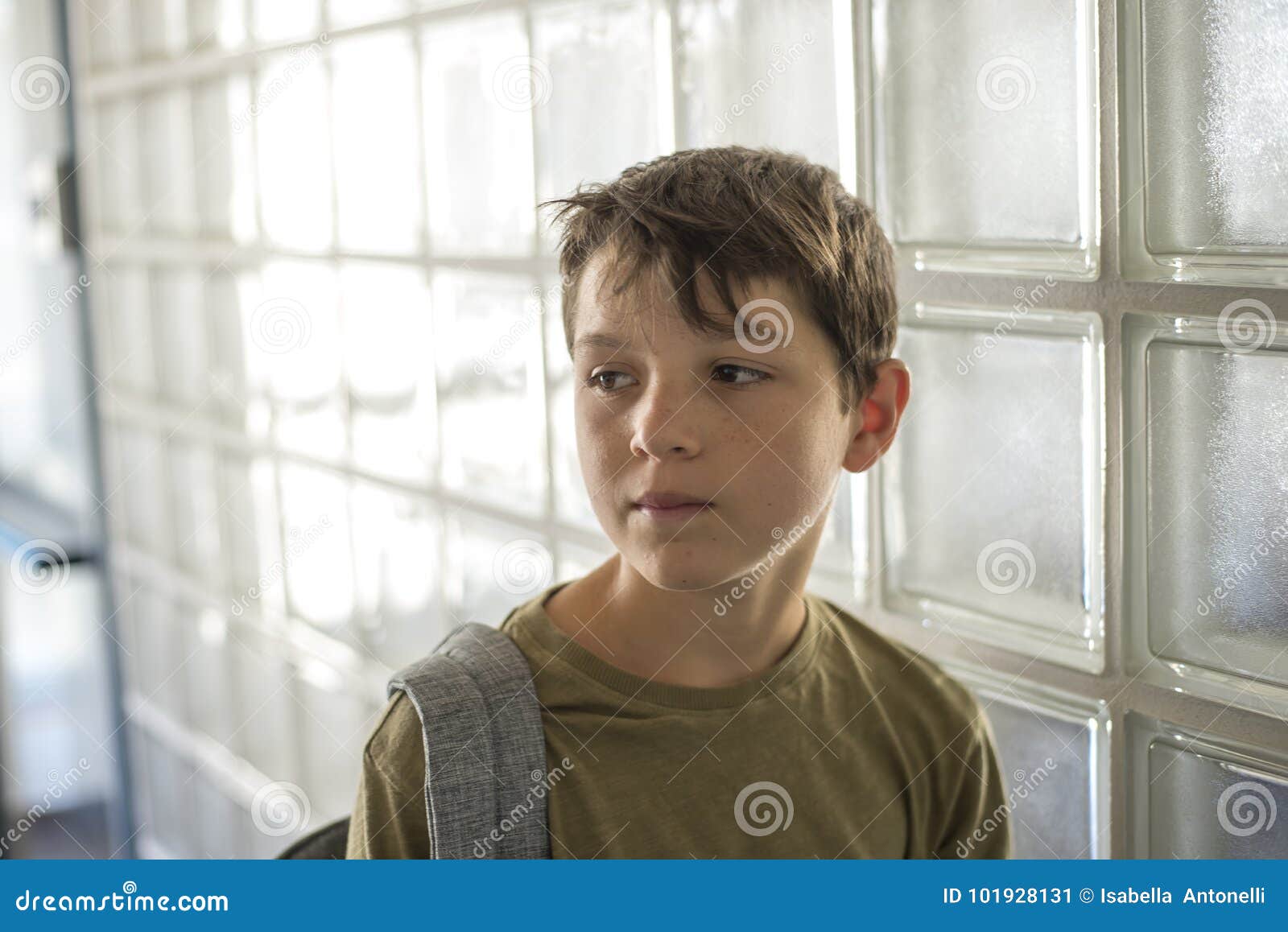 Student Resting on the School and Playing with a Mobile Phone Stock ...