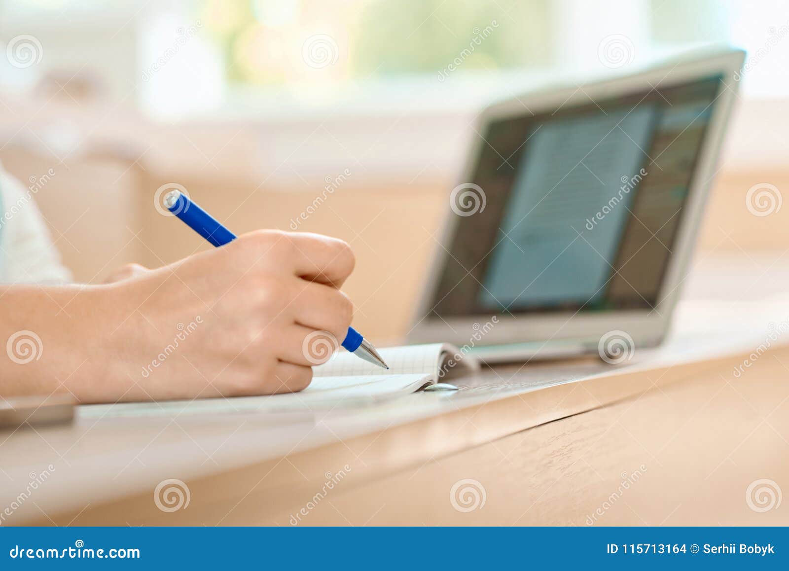Student`s Hand Keeping a Pen and Writing in Notebook. Stock Photo ...