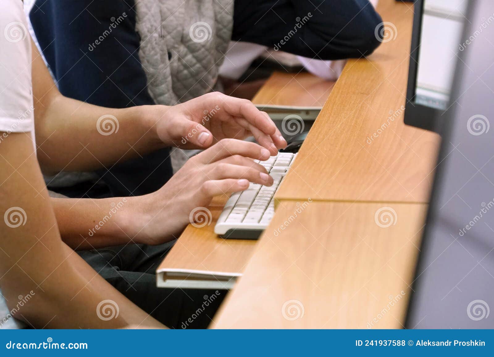 Student& X27;s Hands at the Computer Keyboard in Computer Classroom ...