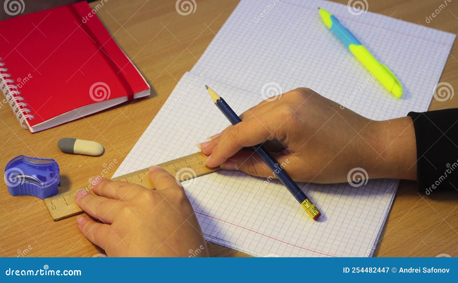 The Student S Hands Draw a Triangle with a Pencil Using a Ruler, Close ...