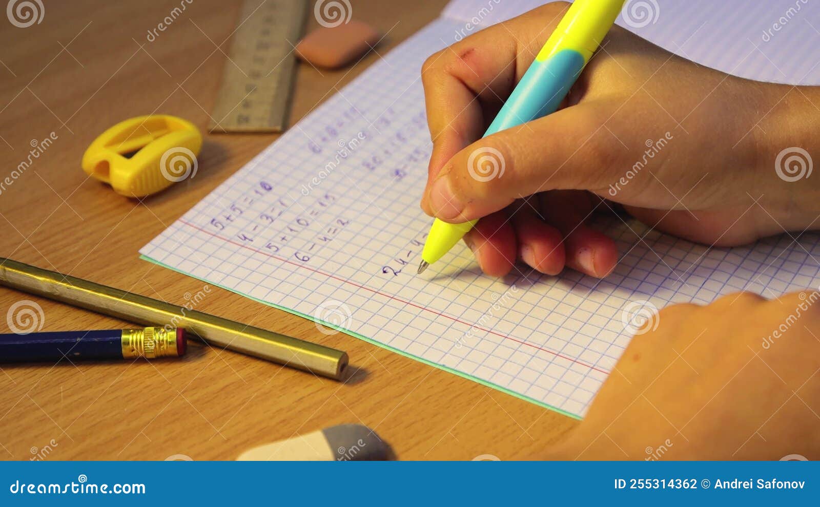 The Student S Hands Solve Mathematical Examples in a Notebook, Close-up ...