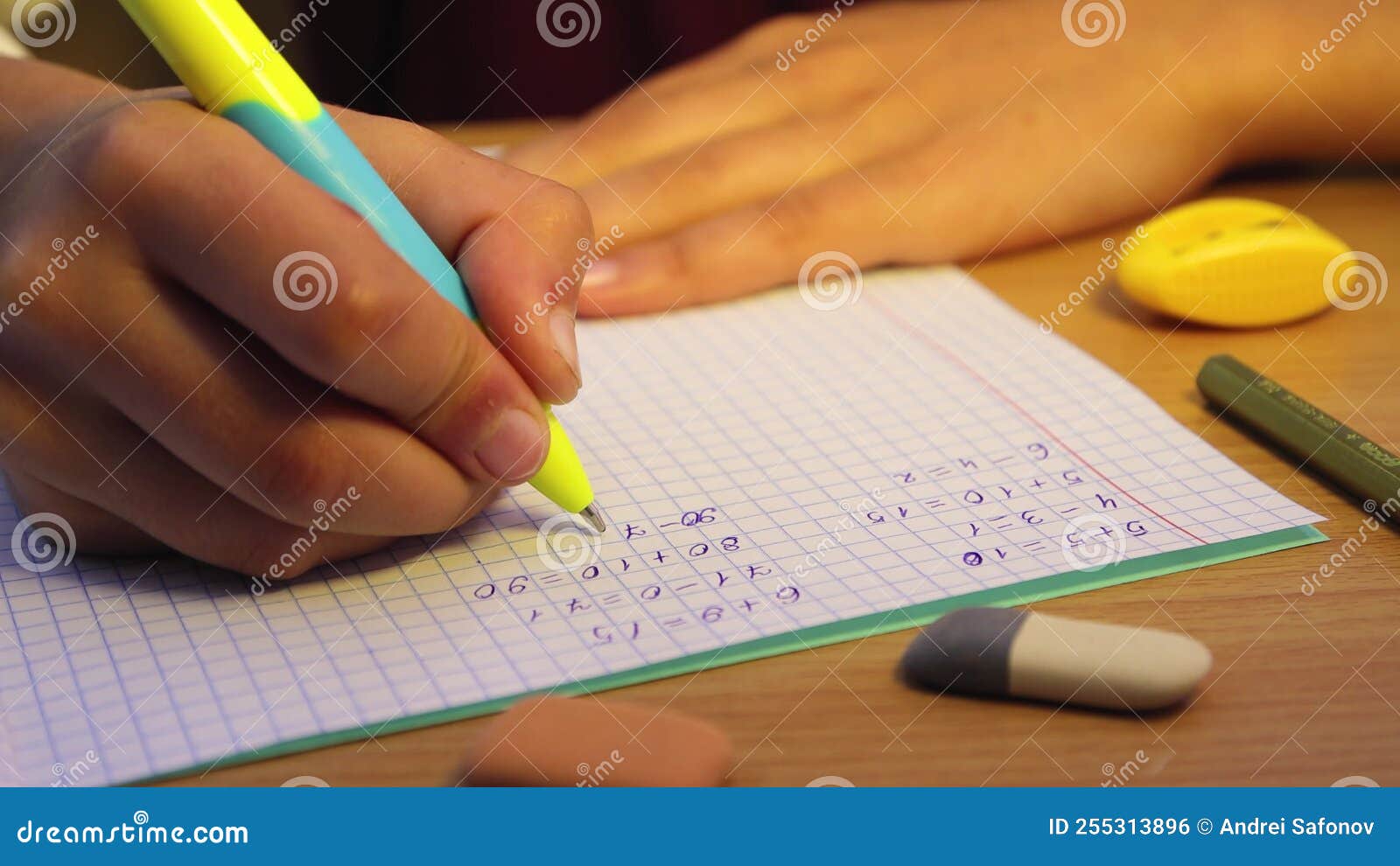 The Student S Hands Write Mathematical Examples in a Notebook, Close-up ...