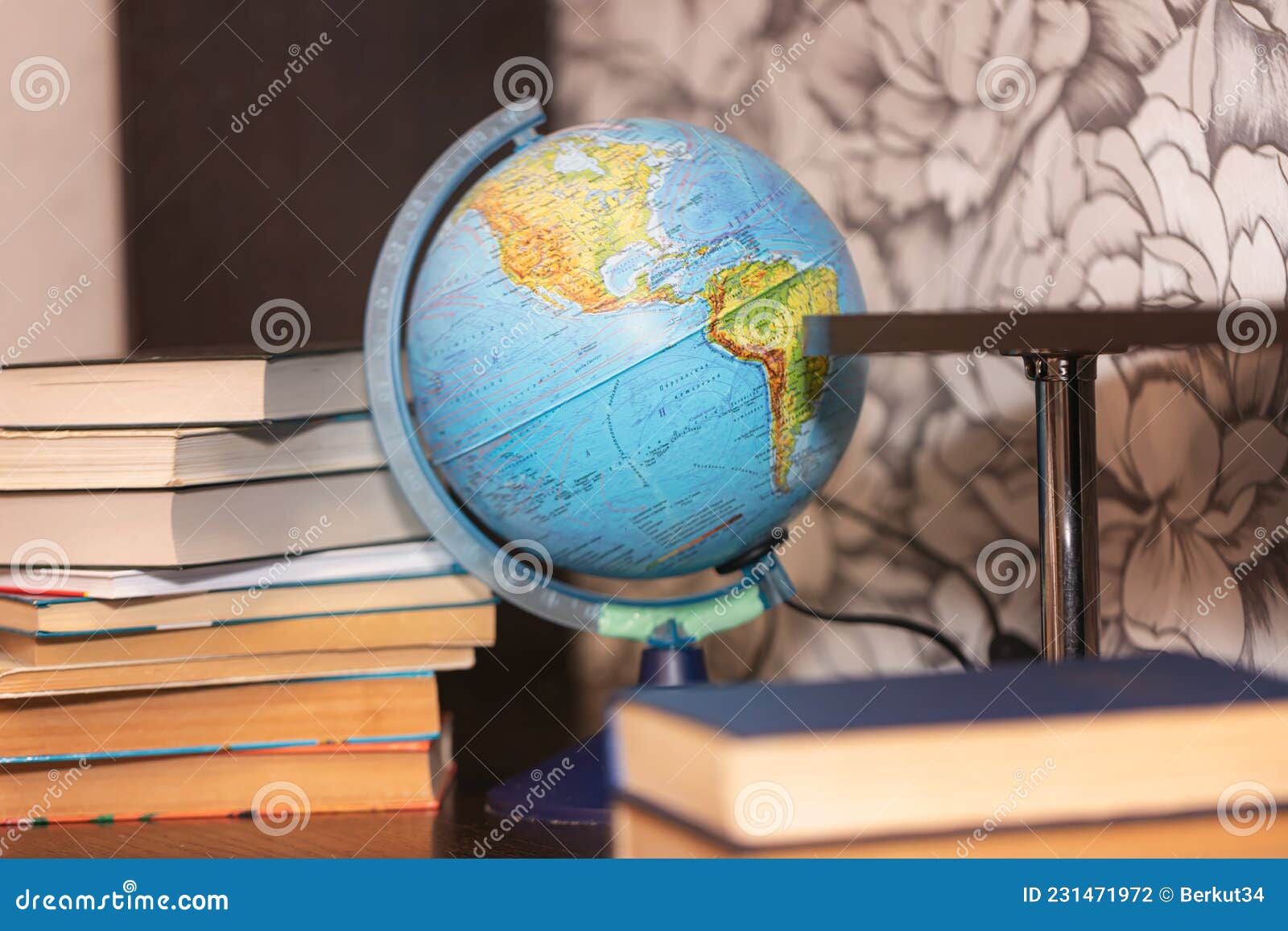 The Student S Homework Table is Filled with Books and a Globe Stock ...