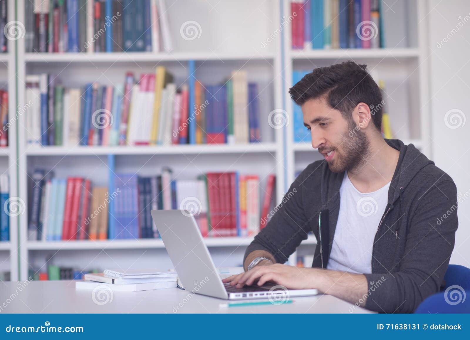 Student in School Library Using Laptop for Research Stock Image - Image ...