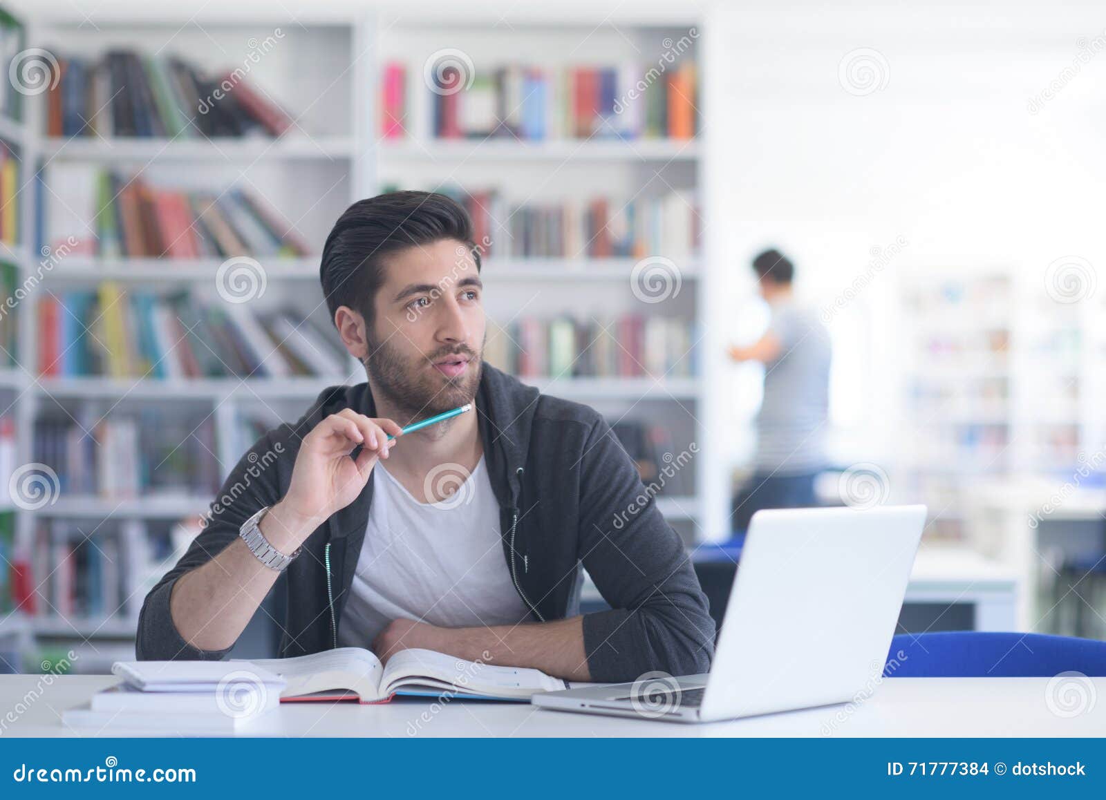 Student in School Library Using Laptop for Research Stock Photo - Image ...