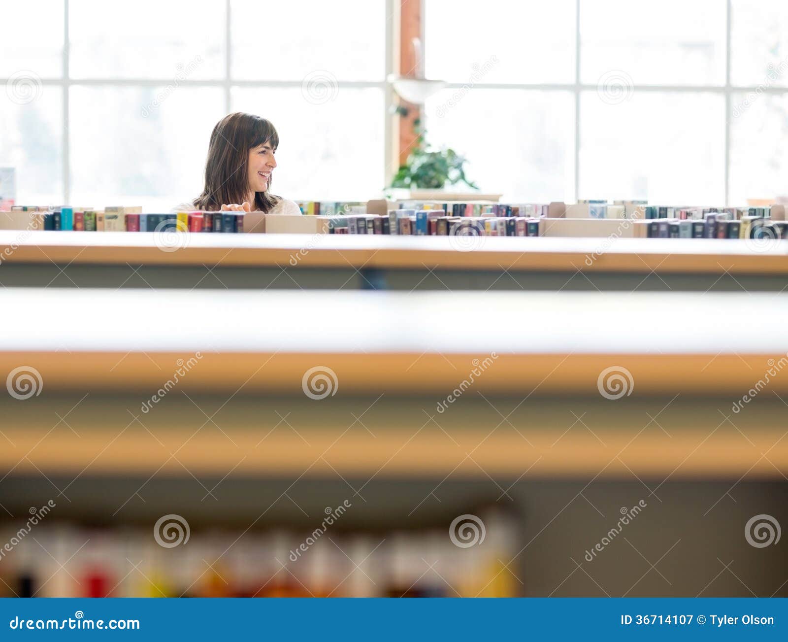 Student Selecting Book in Bookstore Stock Image - Image of read, adult ...