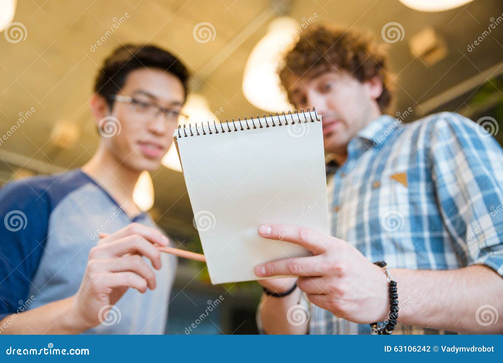 Student Showing His Notes To a Friend Stock Photo - Image of help ...