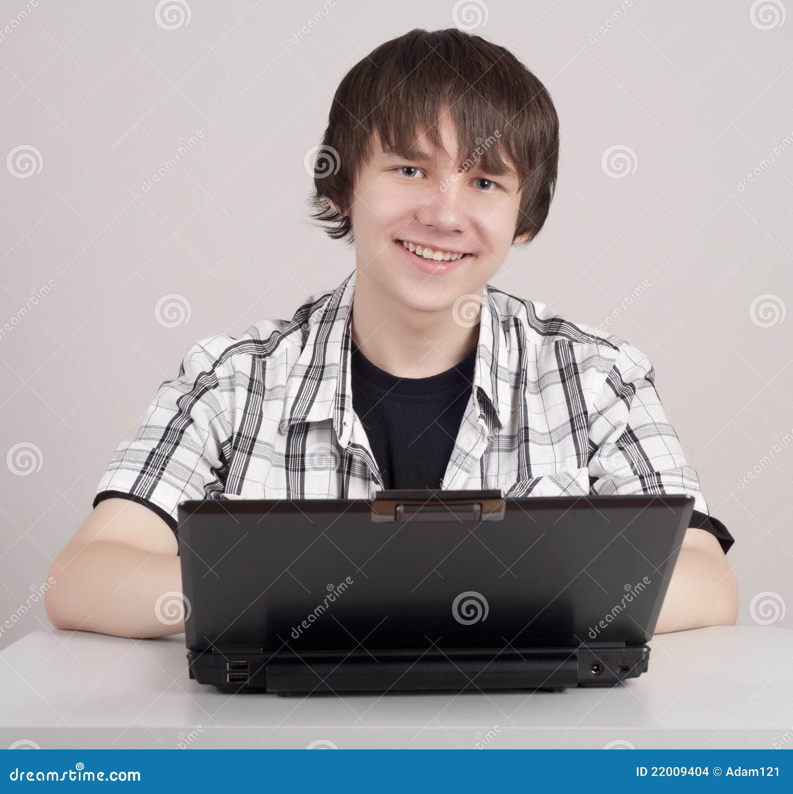 Student Sits for a Portable Computer Stock Photo - Image of head, short ...