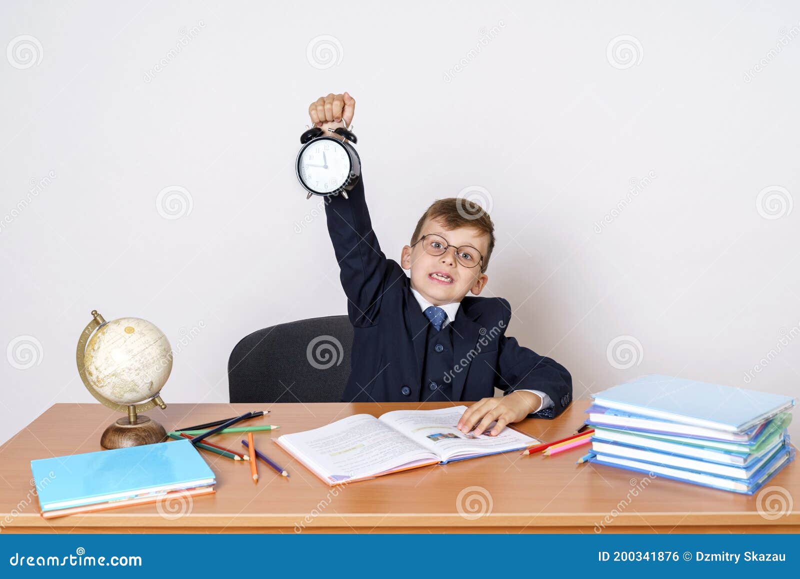 The Student Sits at the Table, Does His Homework and Points To the ...