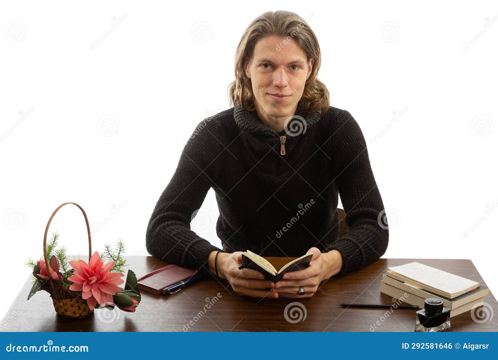 A Student Sits at a Table and Reads a Book Stock Photo - Image of ...