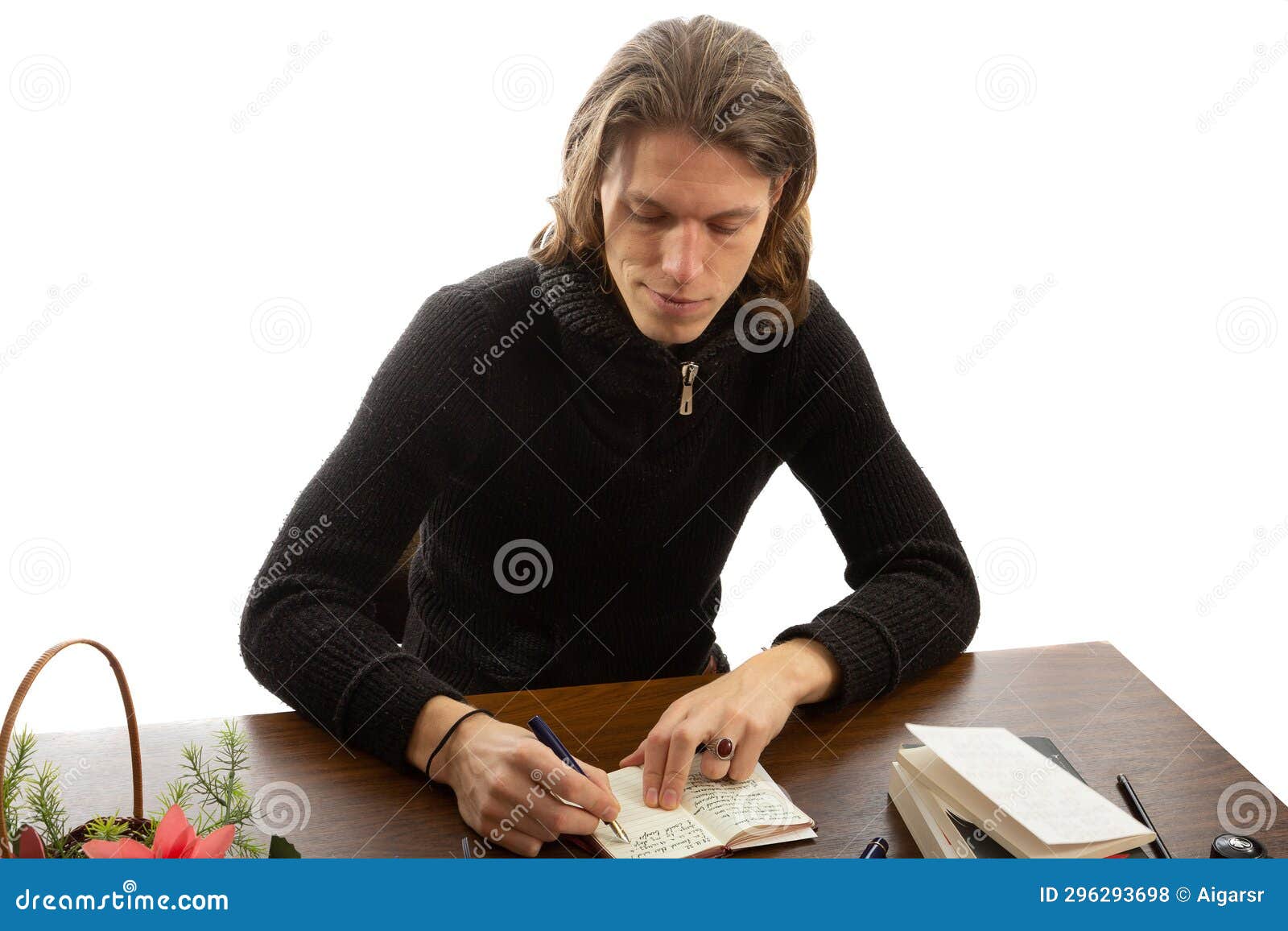 A Student Sits at a Table and Write a Notebook Stock Photo - Image of ...
