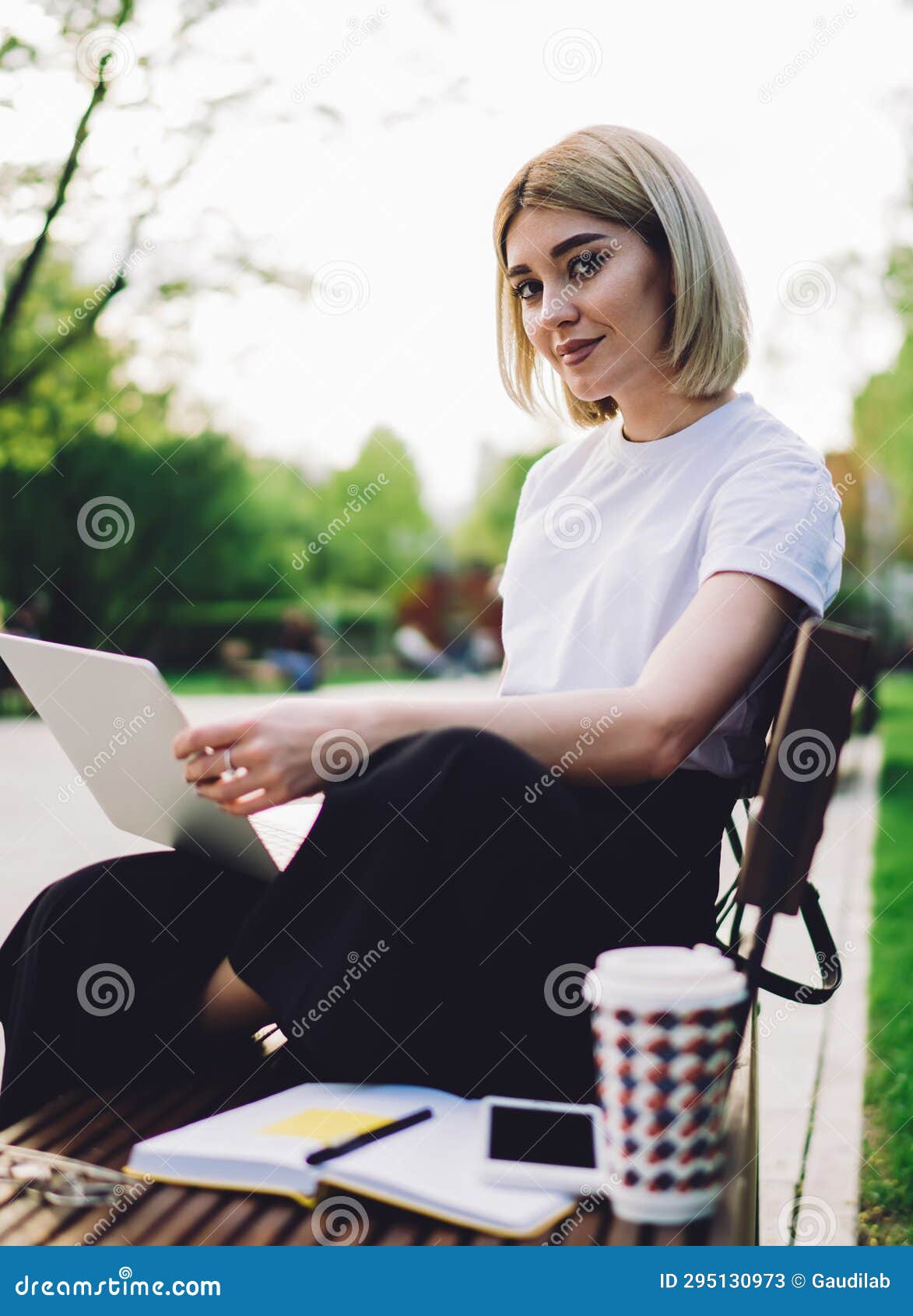 Student Sitting on Bench with Laptop and Looking at Camera Stock Image ...