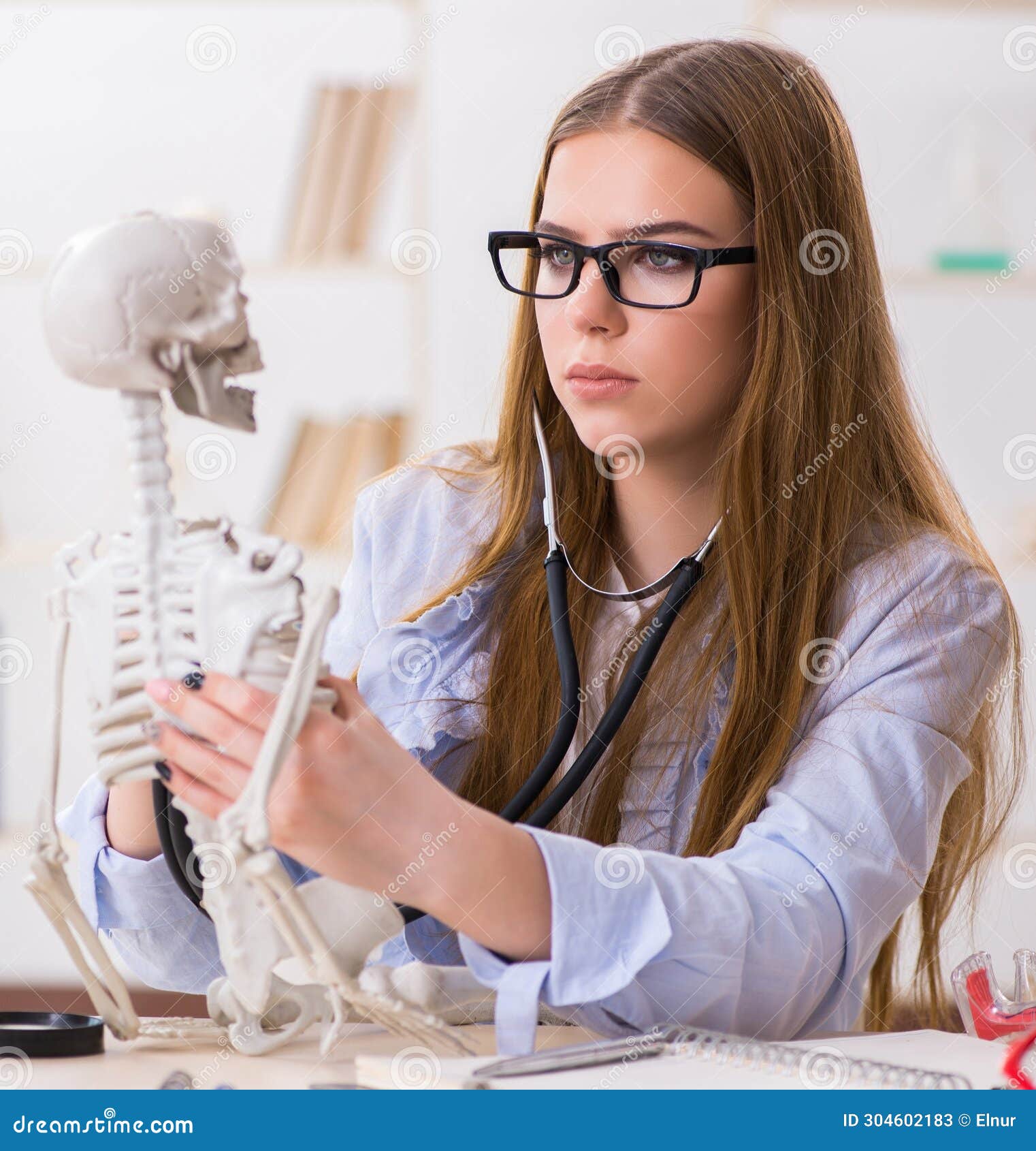 Student Sitting in Classroom and Studying Skeleton Stock Image - Image ...