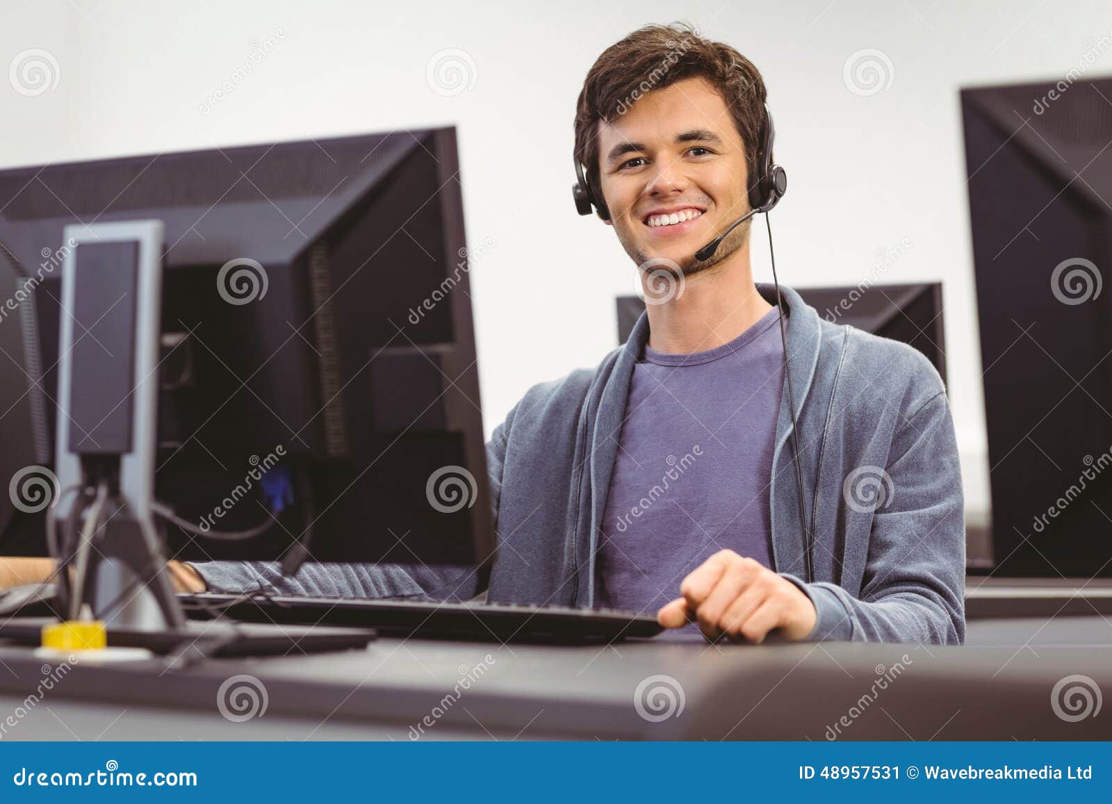 Student Sitting at the Computer Room Wearing Headset Stock Image ...