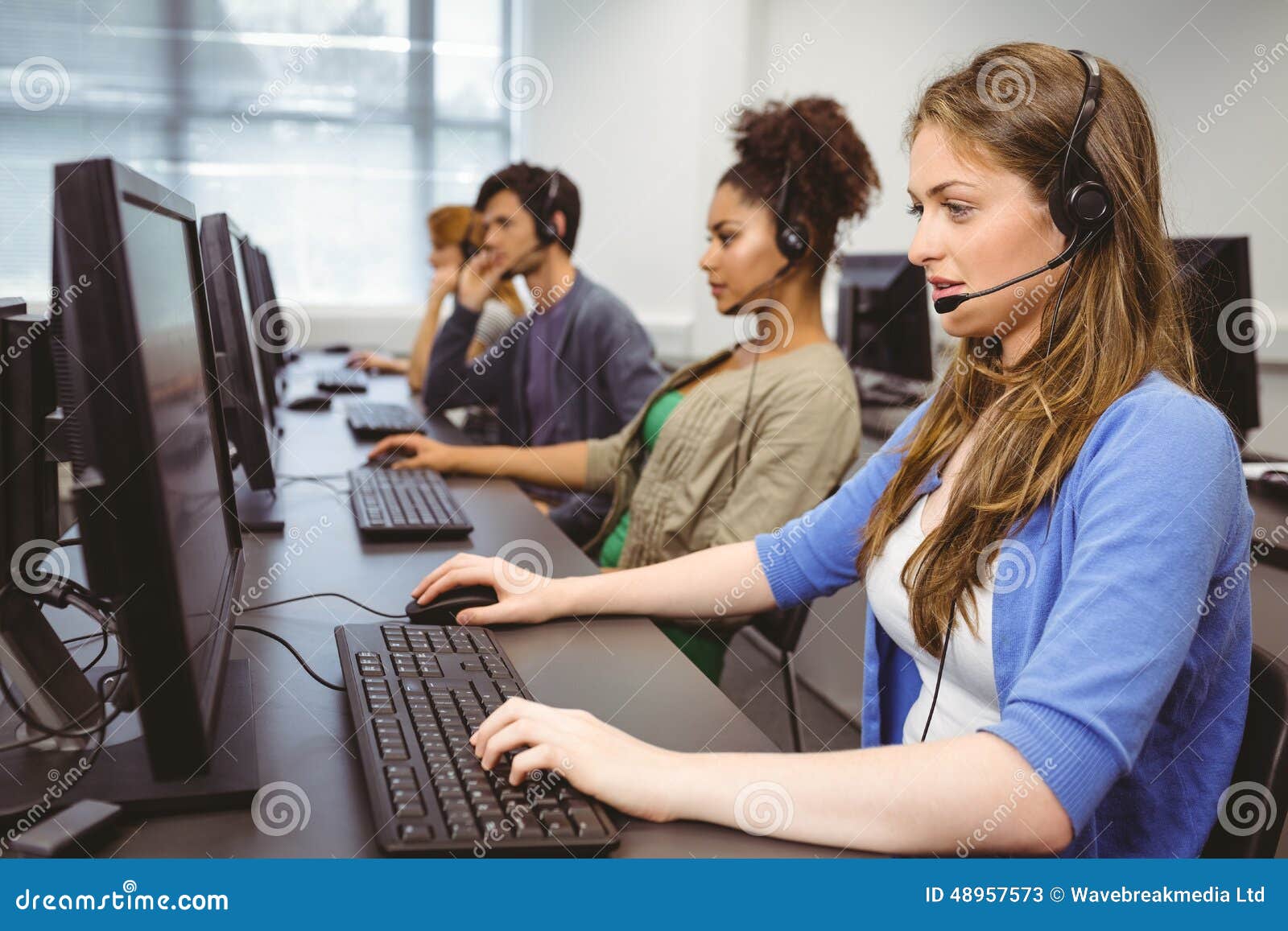 Student Sitting at the Computer Room Wearing Headset Stock Image ...