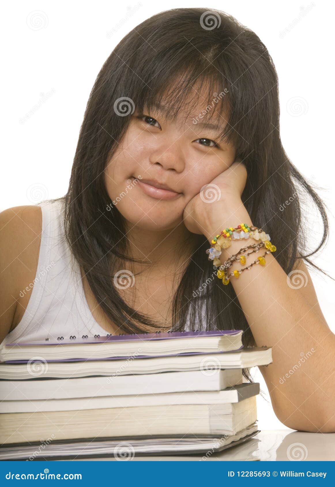 Student Sitting Down at Desk with Her School Books Stock Image - Image ...